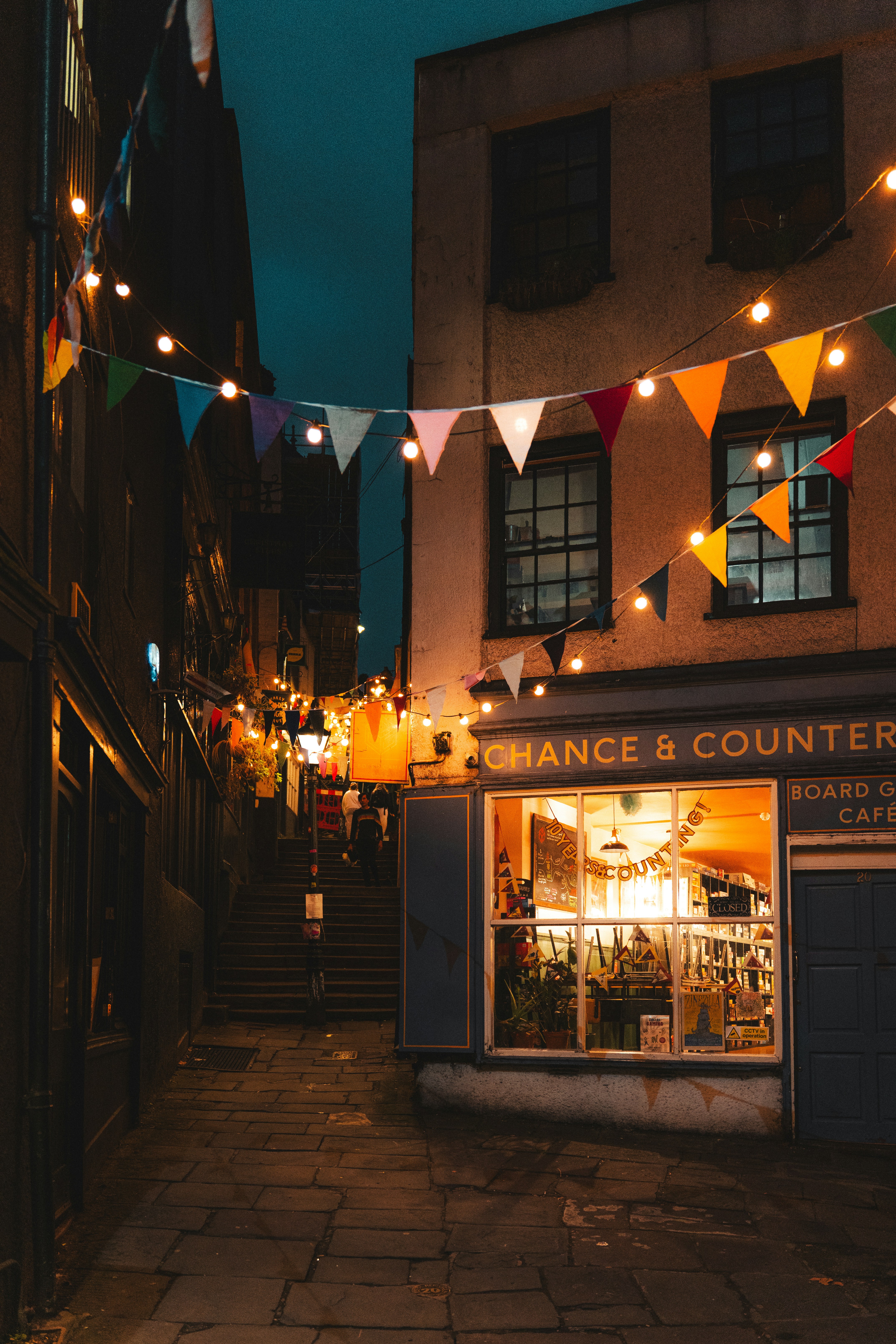 Warm Lanterns Over a Narrow Alley Café