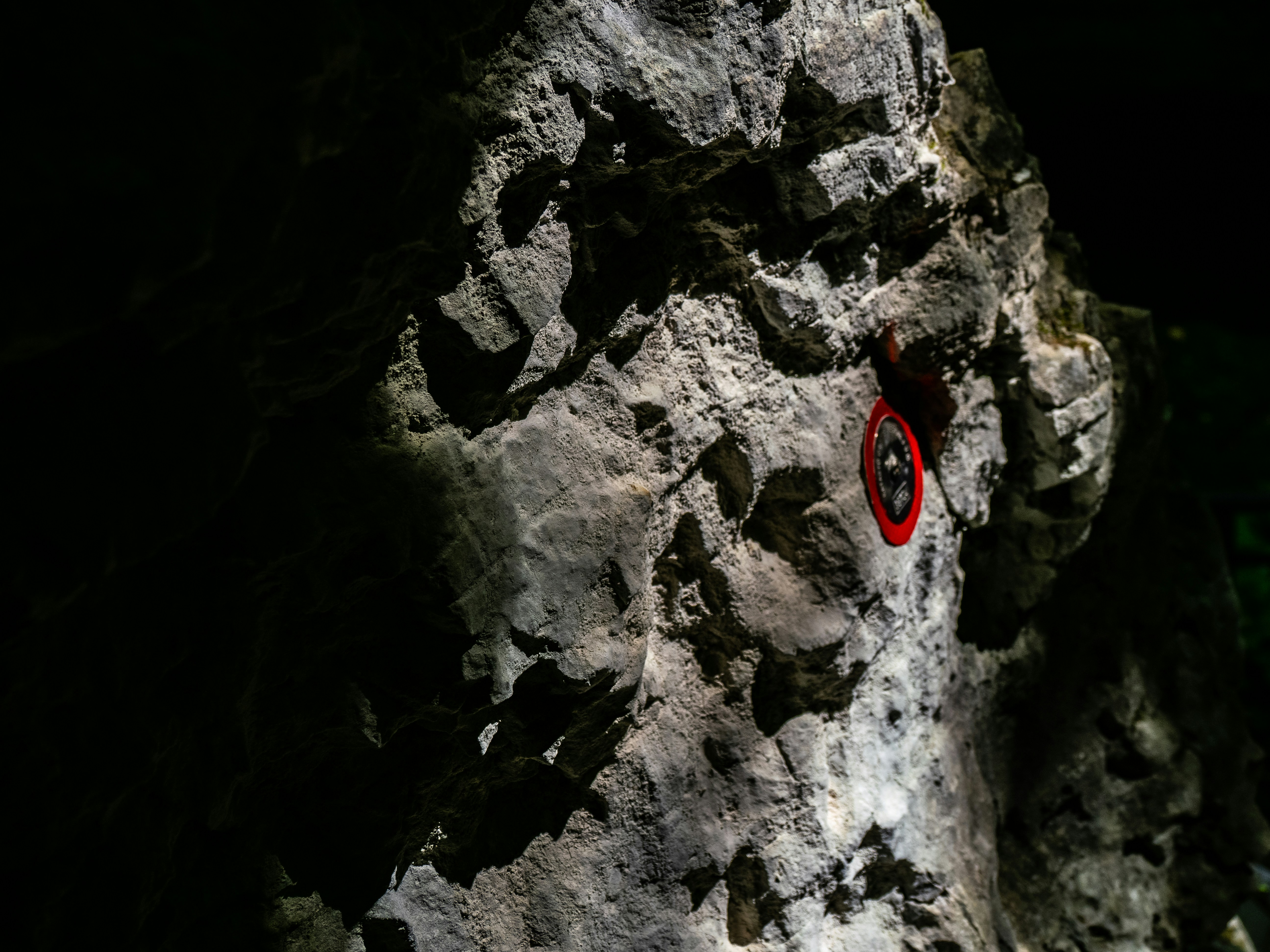 Red Ring on Weathered Rock: A Quiet Clue in the Cave Wall