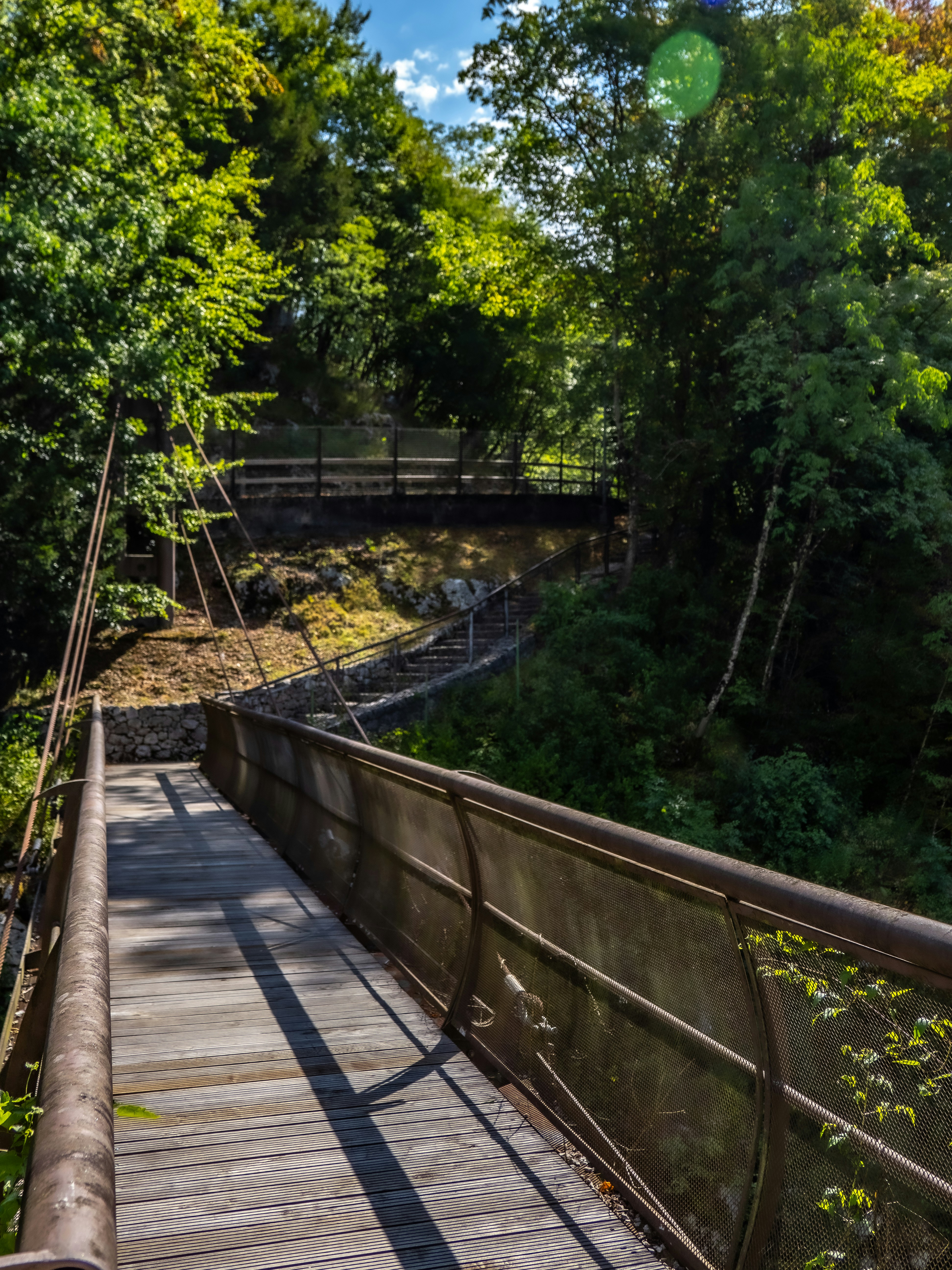 Bridge over a shaded river ravine