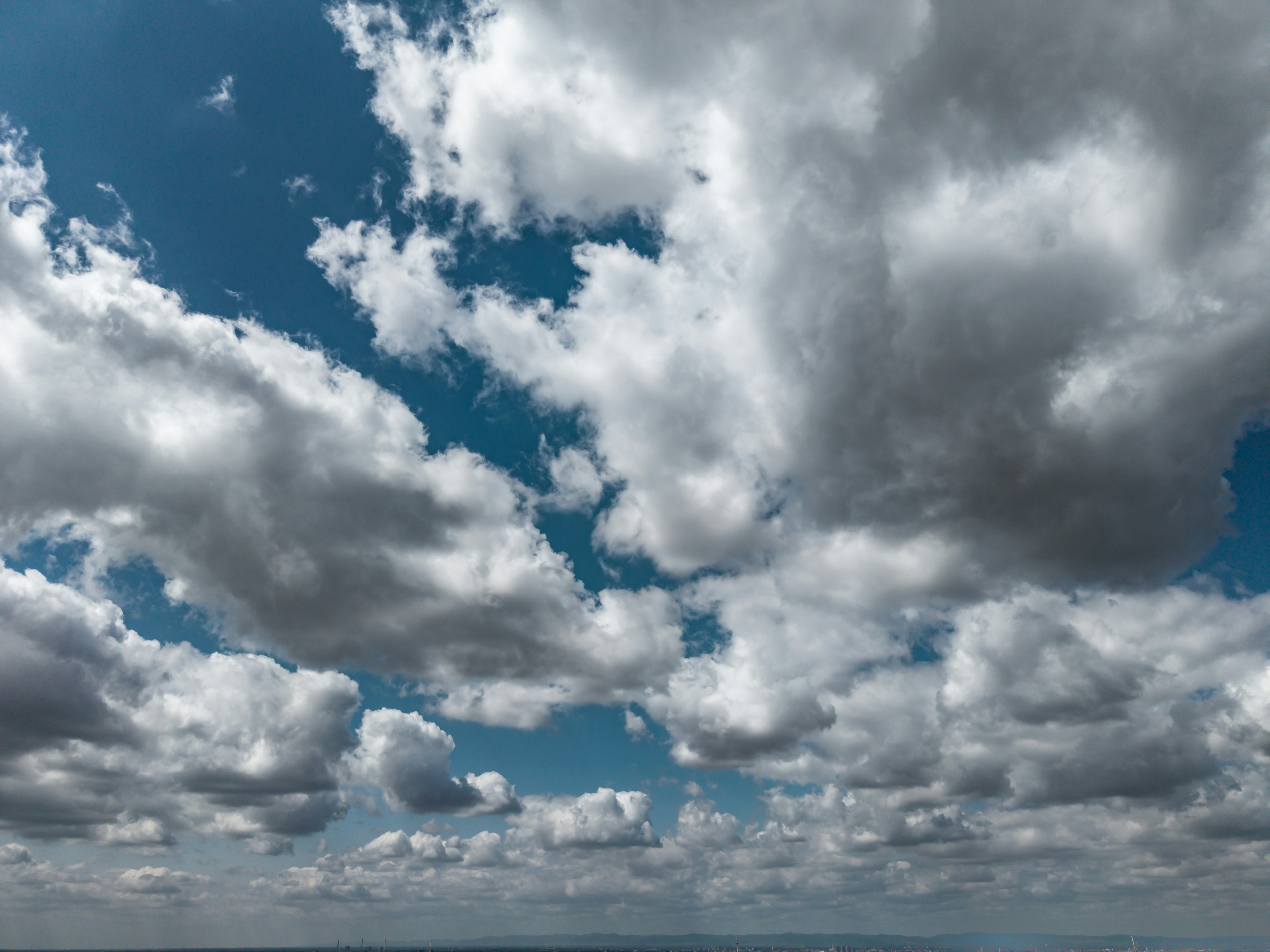 Sky Quilt: A Field of Clouds Over a Distant Horizon