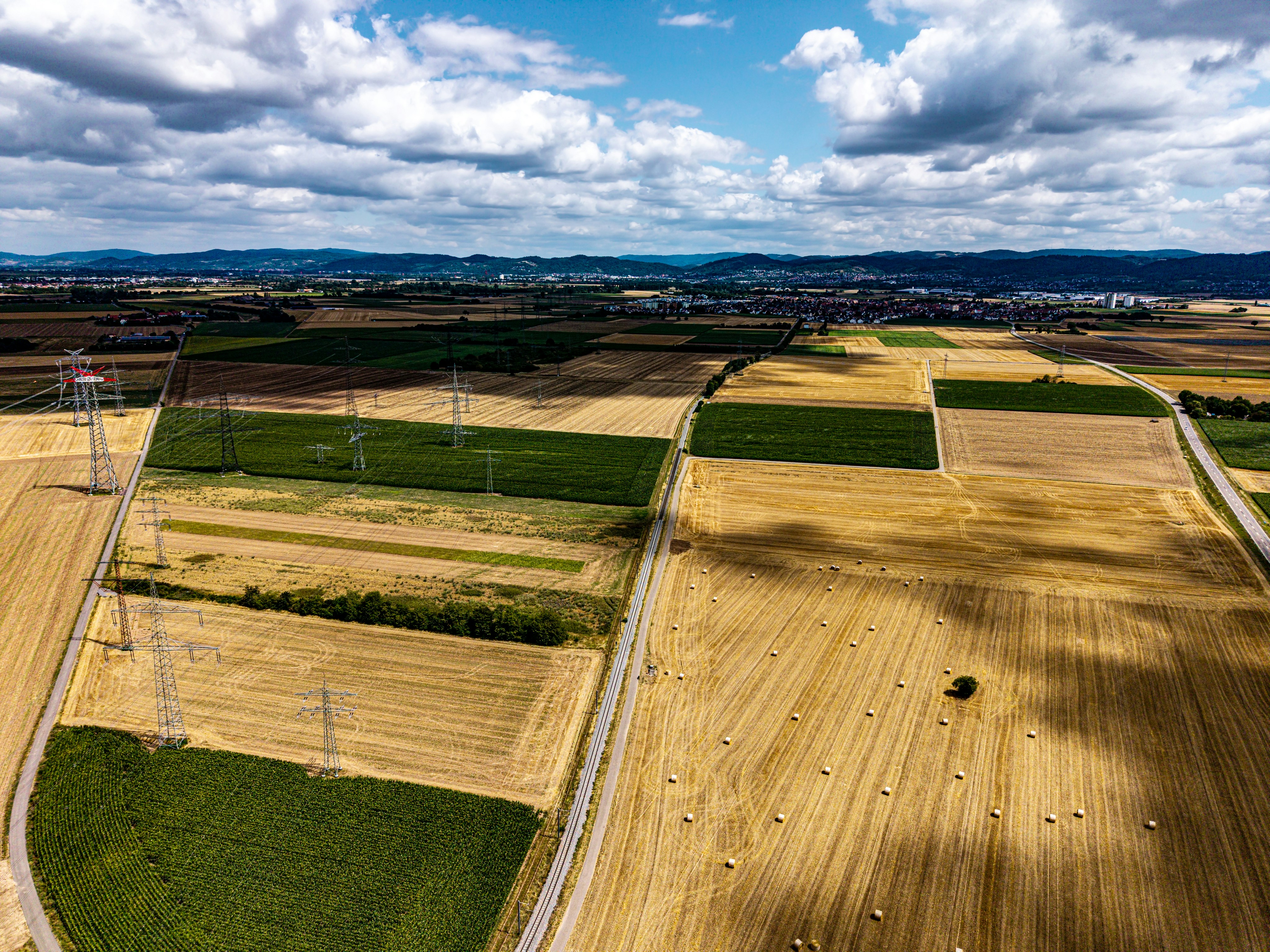 Patchwork Fields Under a Sky of Puffs
