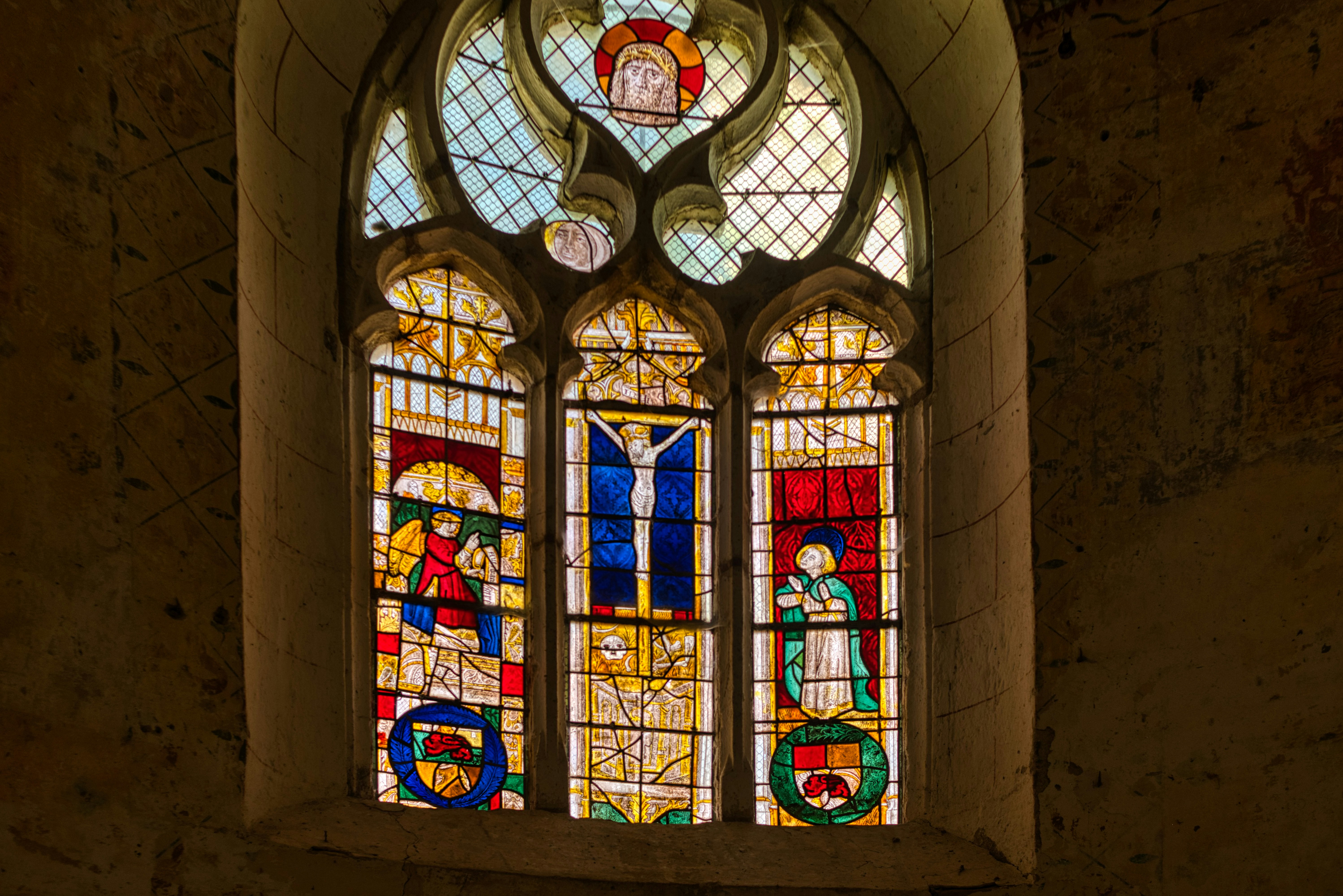 Stained Glass Cathedral Window: Vivid panels in a historic arch