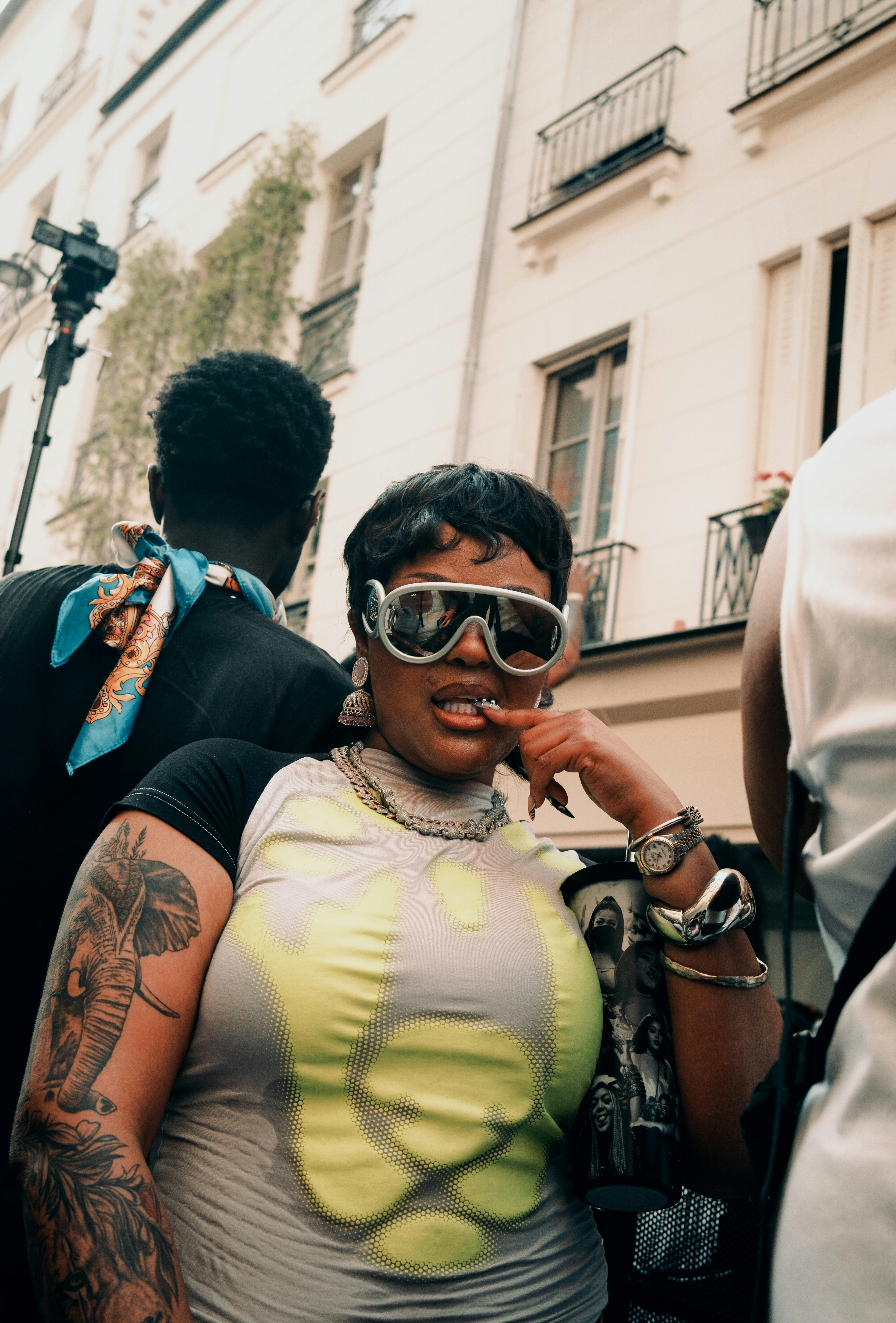 Gaze Behind mirrored goggles at a street-side moment