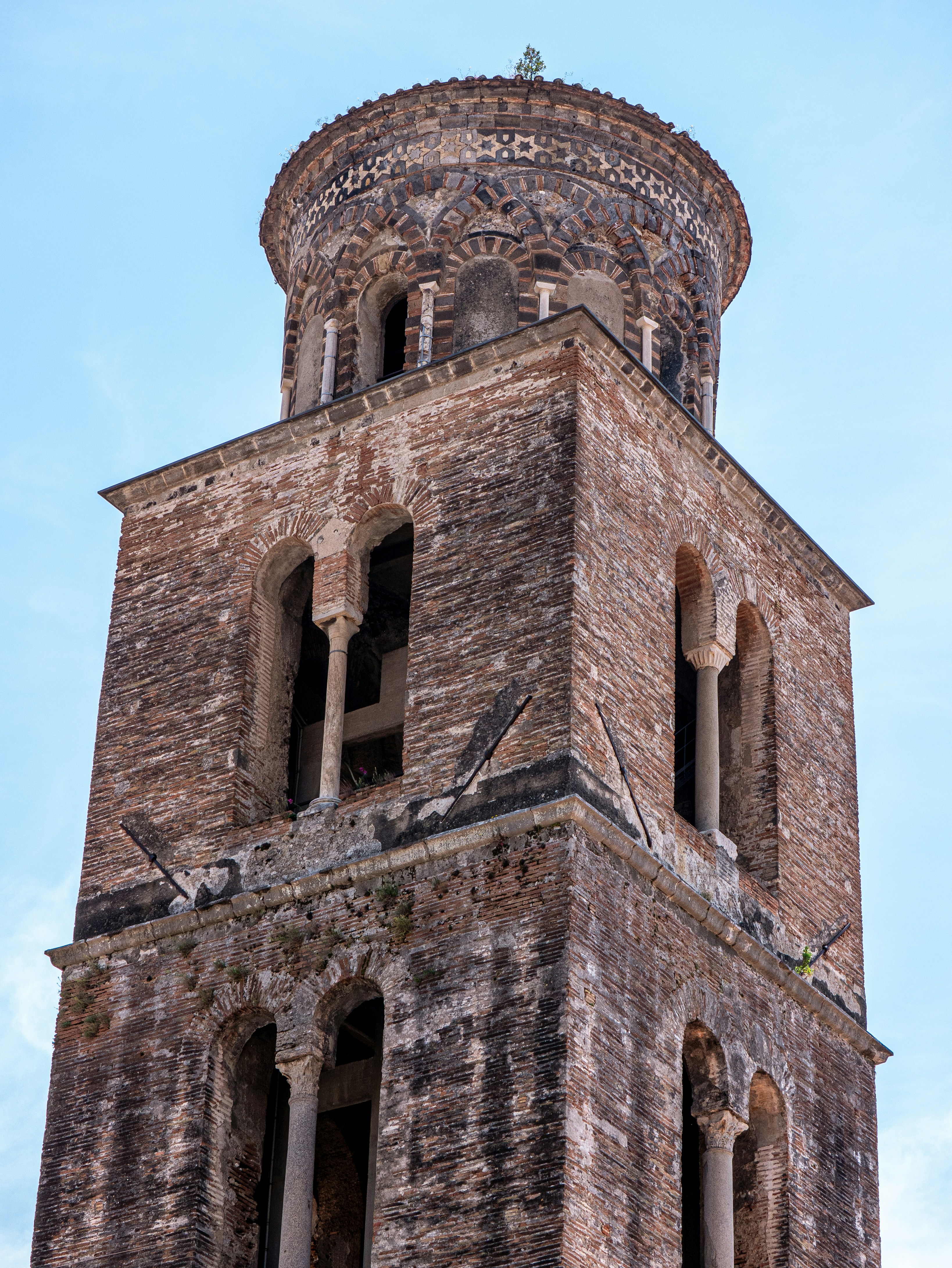 Crumbled Brick Bell Tower Reaching Toward a Clear Sky