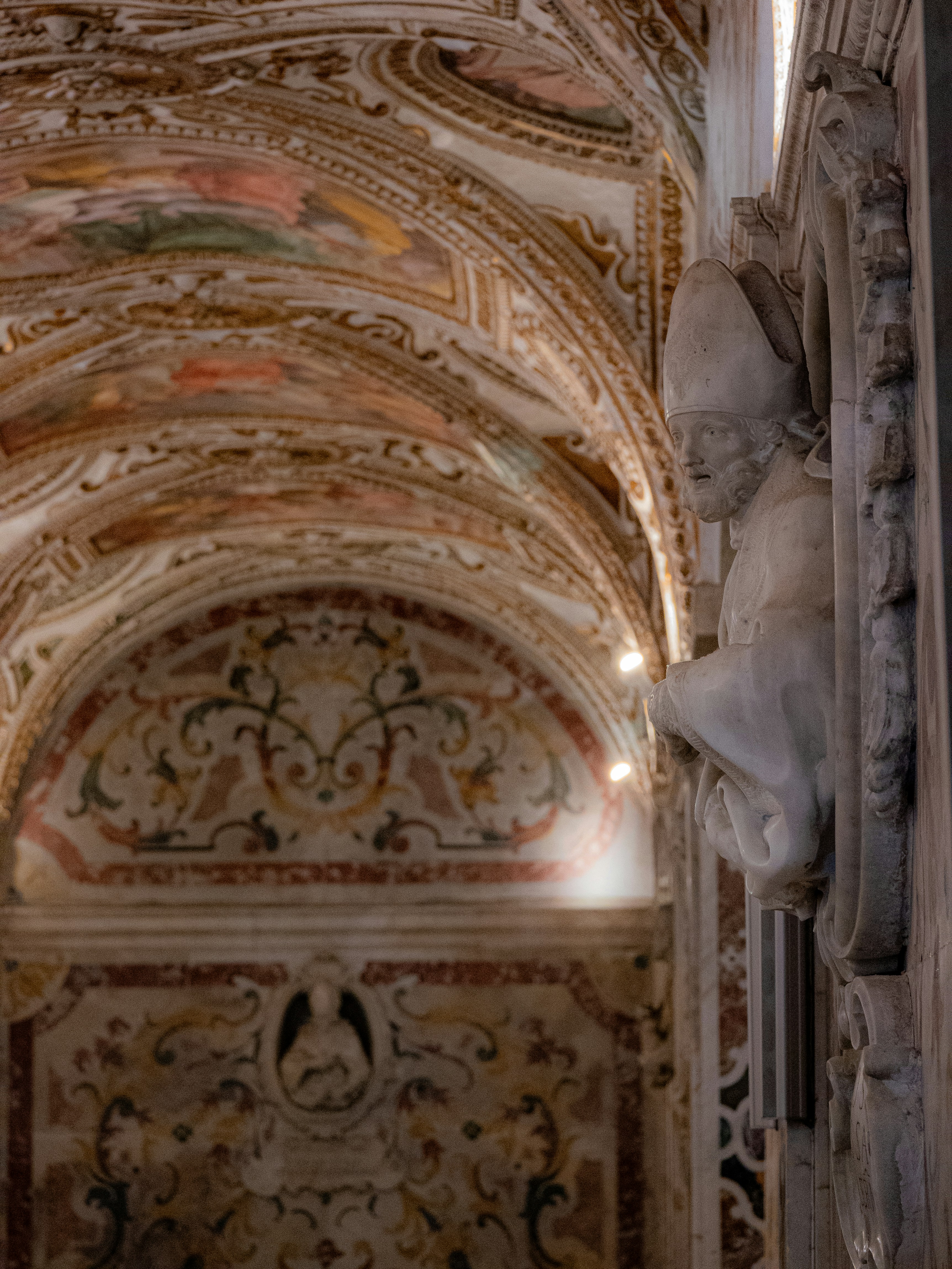 Gothic Shrine: A Guardian Statue under Ornate Vaults