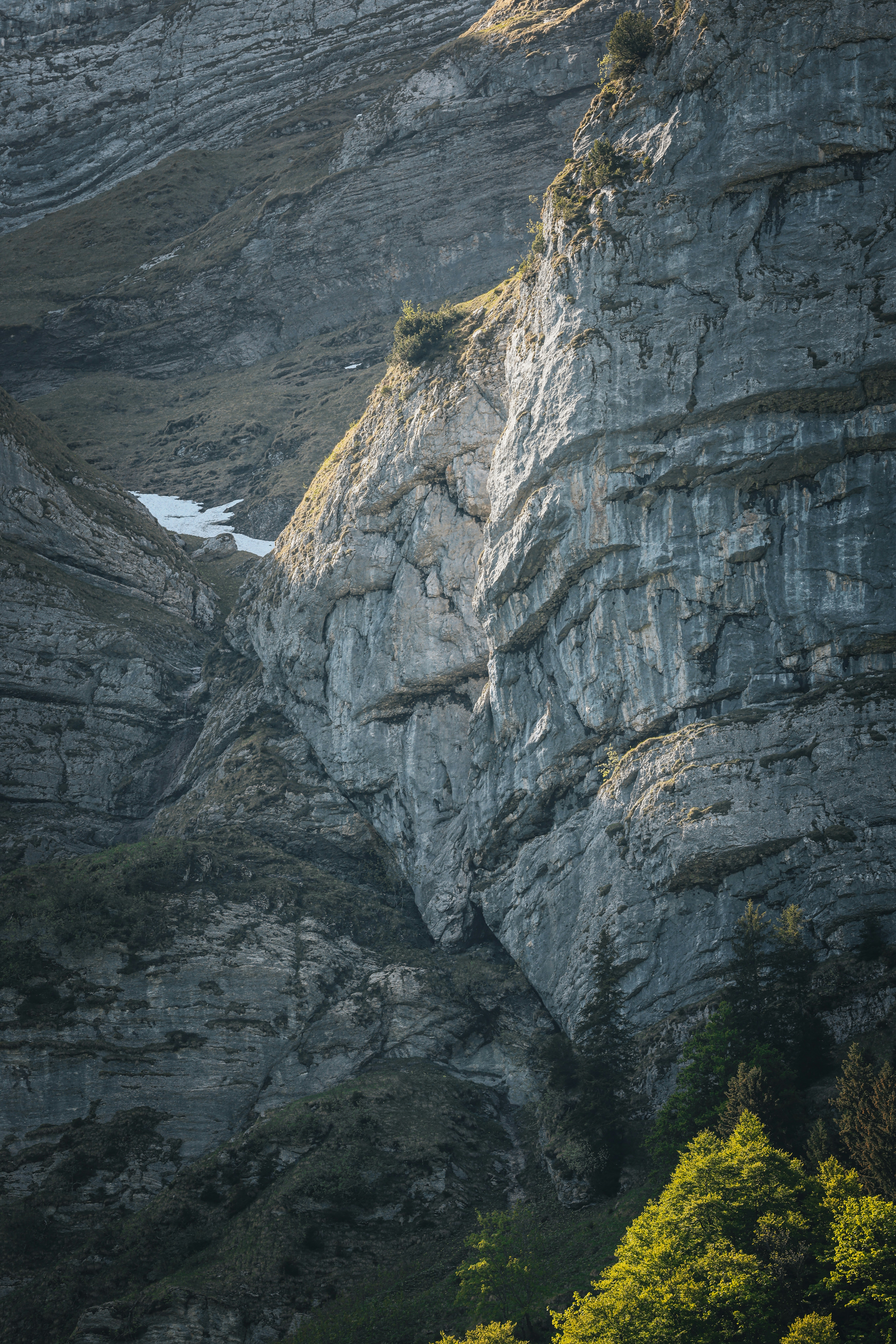 Sunlit Cliff Faces: A Quiet Alpine Monolith