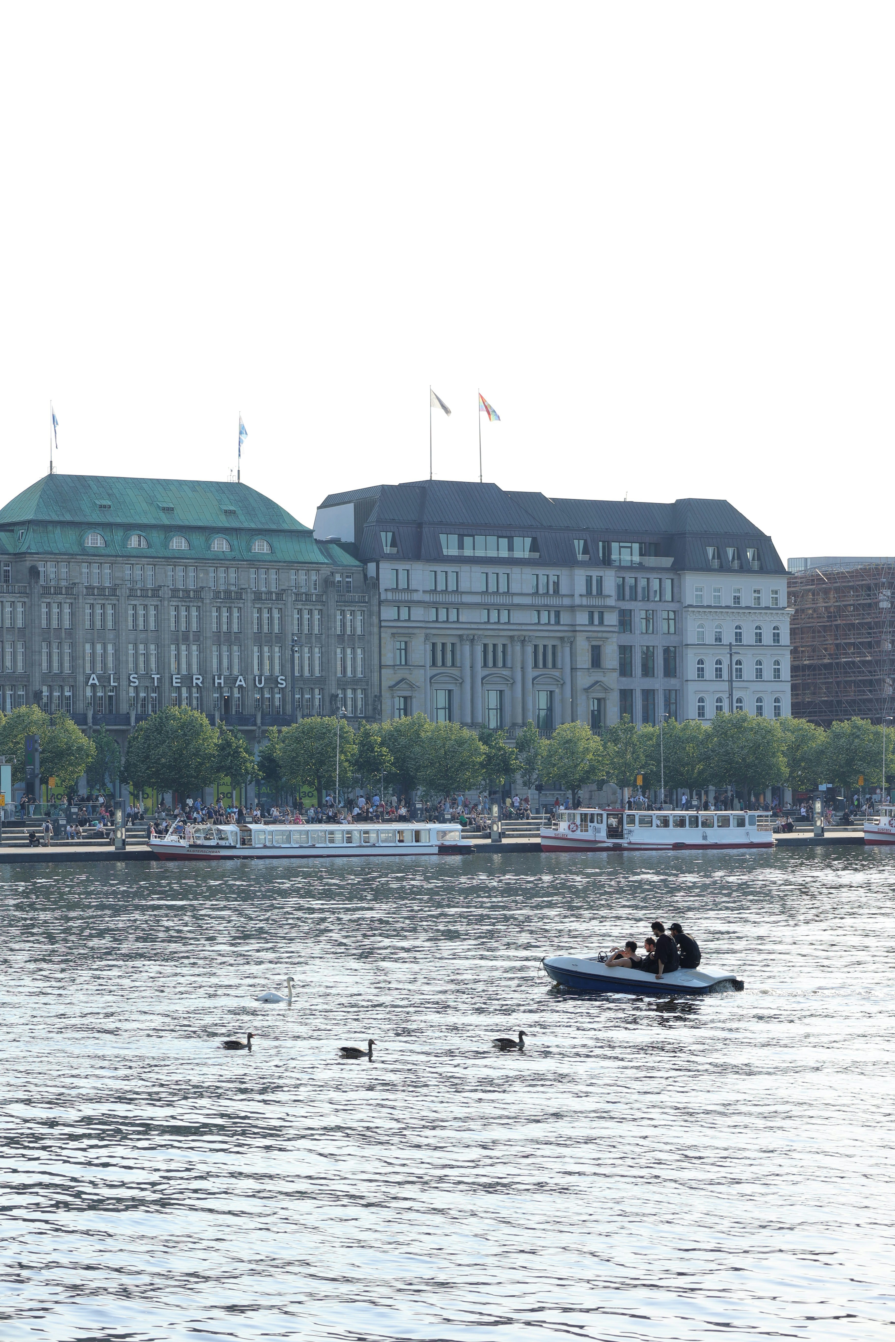 Harbor View from the Promenade: Boats, Buildings, and a Teal Roofline