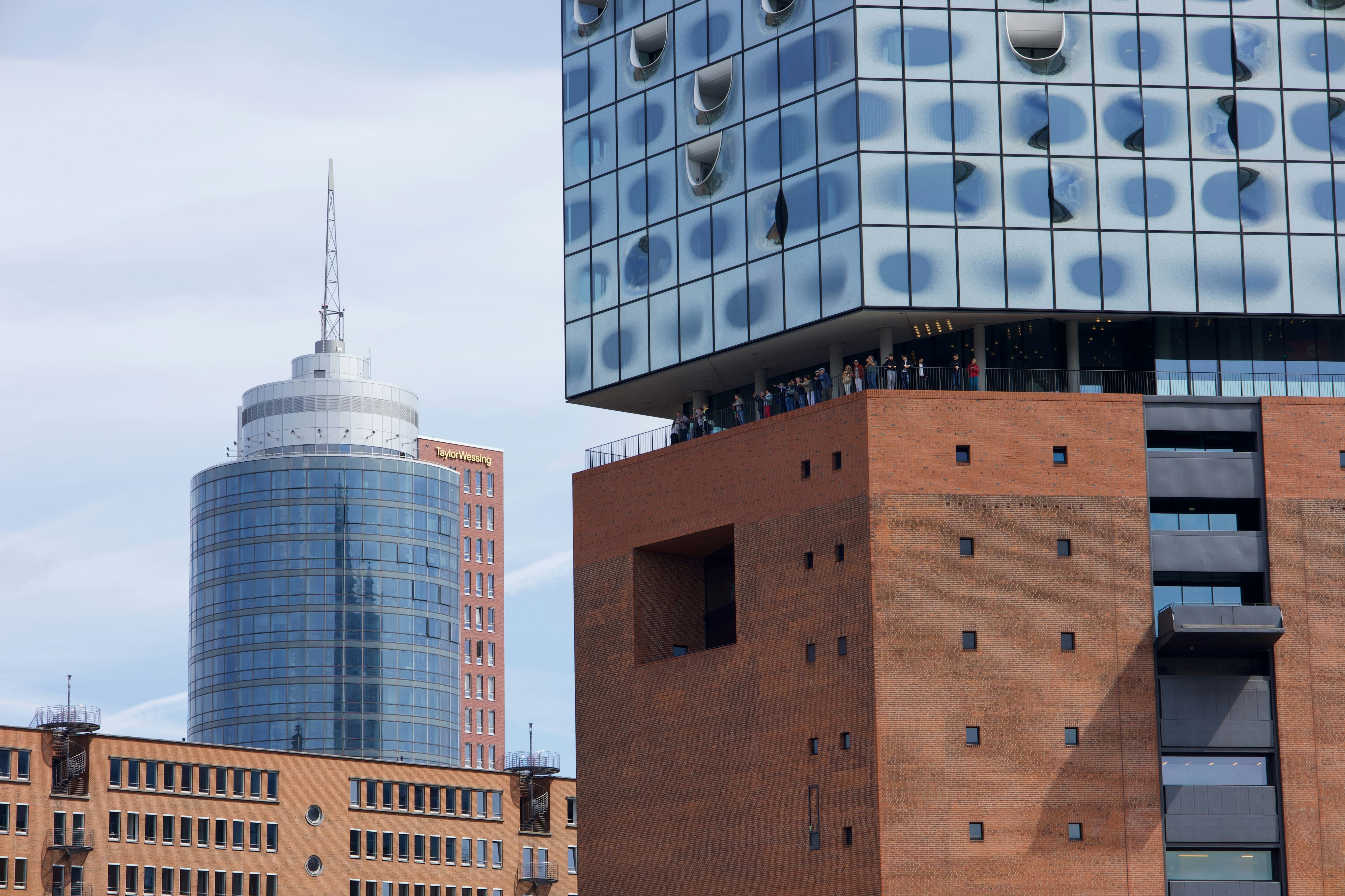 Urban Facade Convergence: Glass, Brick, and Sky