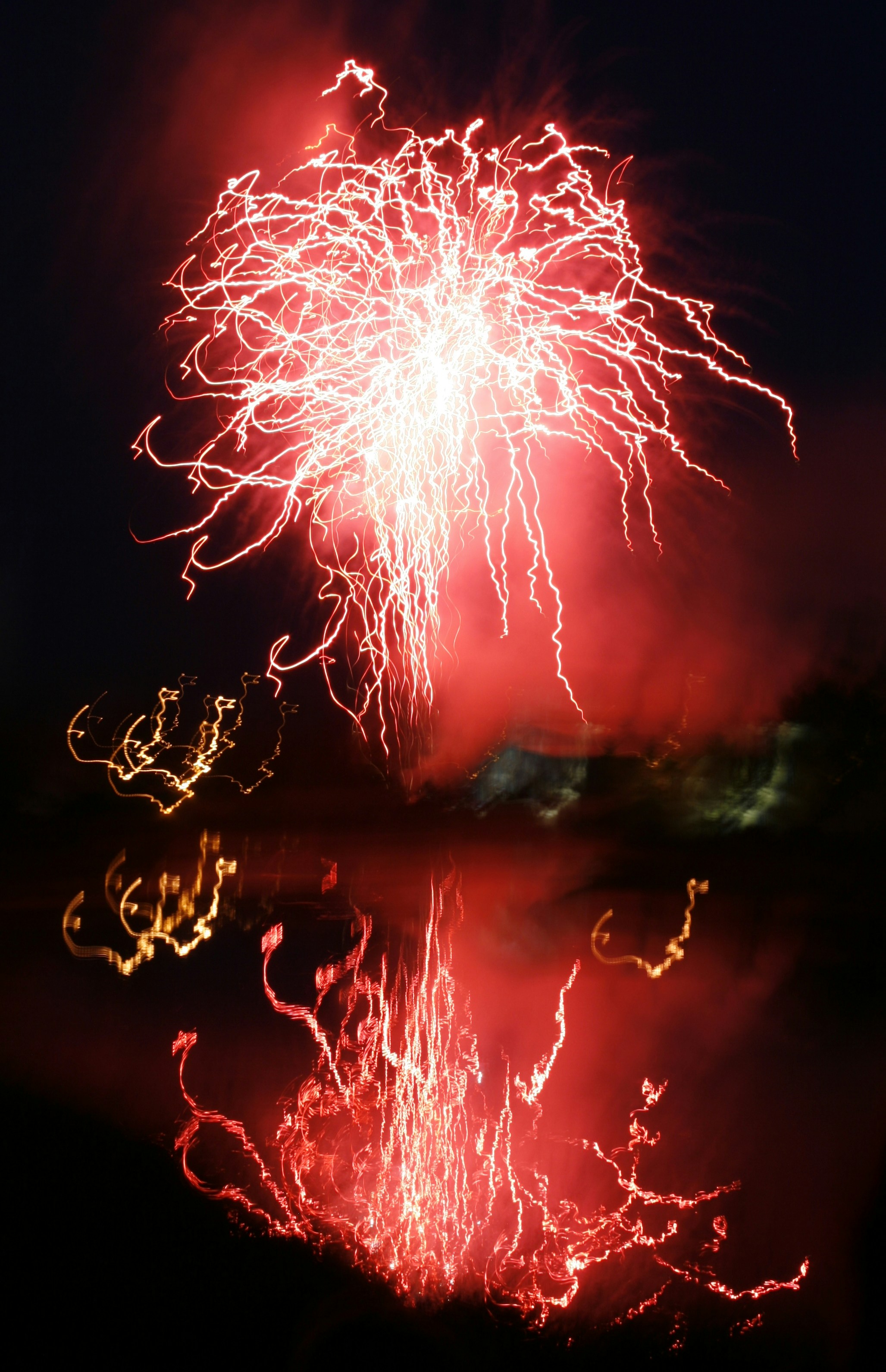 Red Night Bloom: Fireworks Mirror over Silent Water
