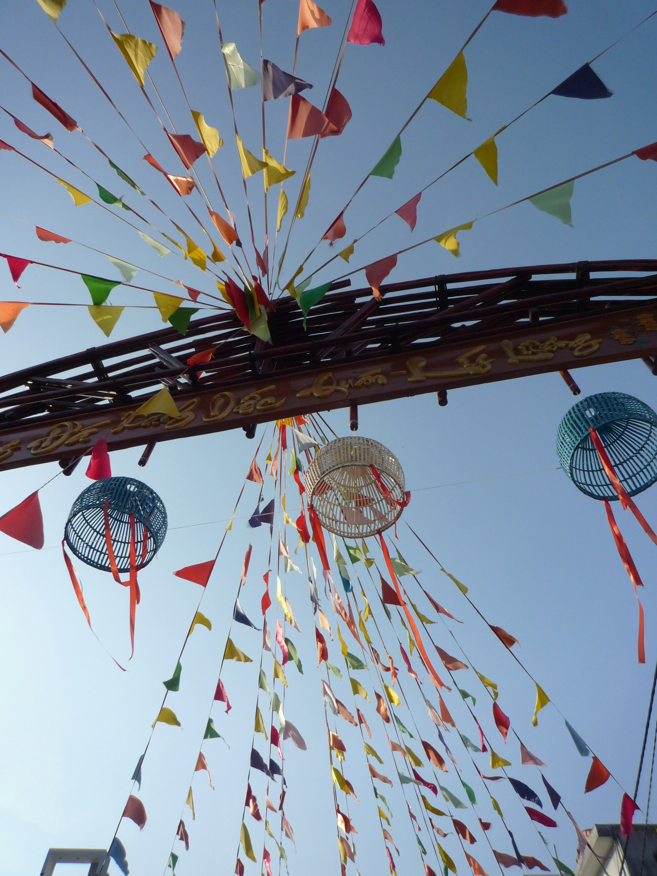 Ceiling of Color: A Skyward Dance of Flags and Lanterns