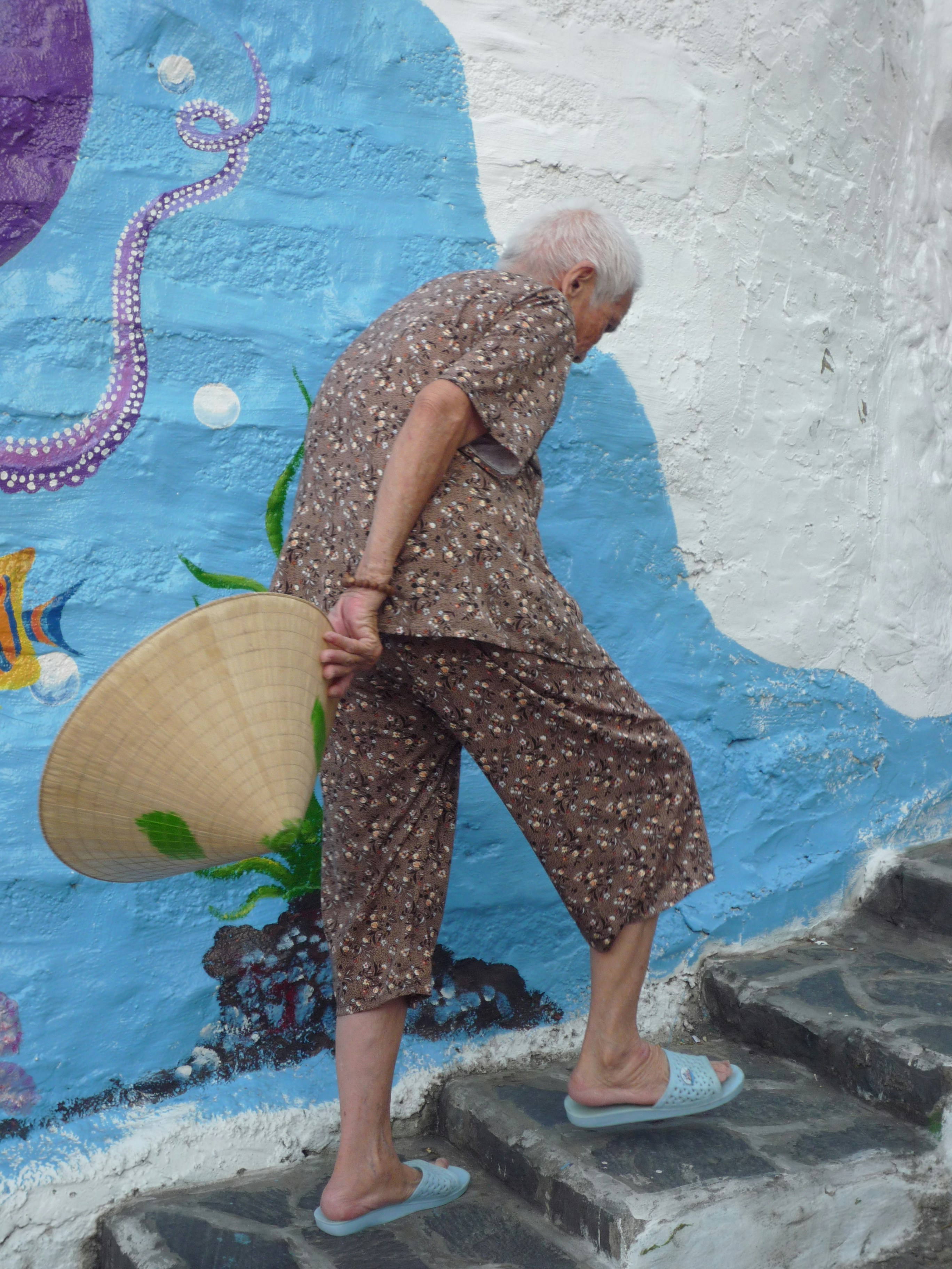 Old Traveler on a Colorful Stairway