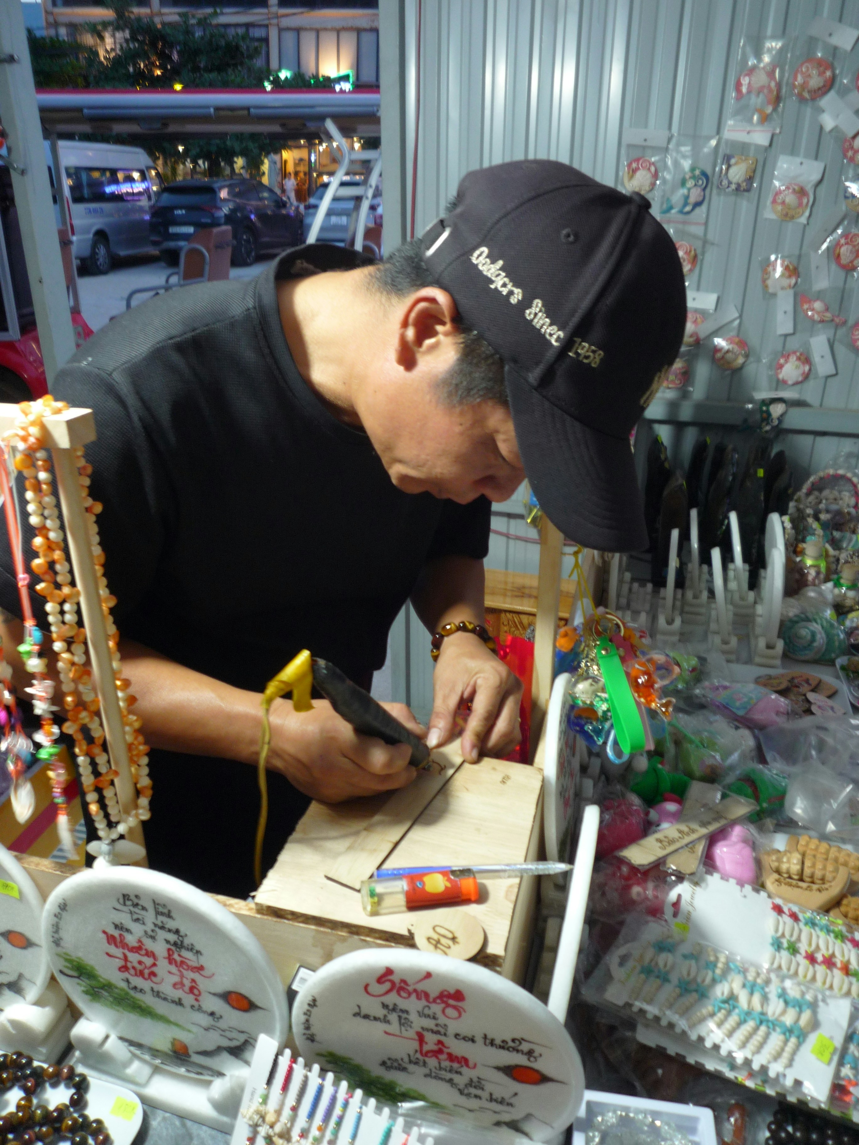 Craftsman at the Workbench: A Hat, Glue, and Glass Beads