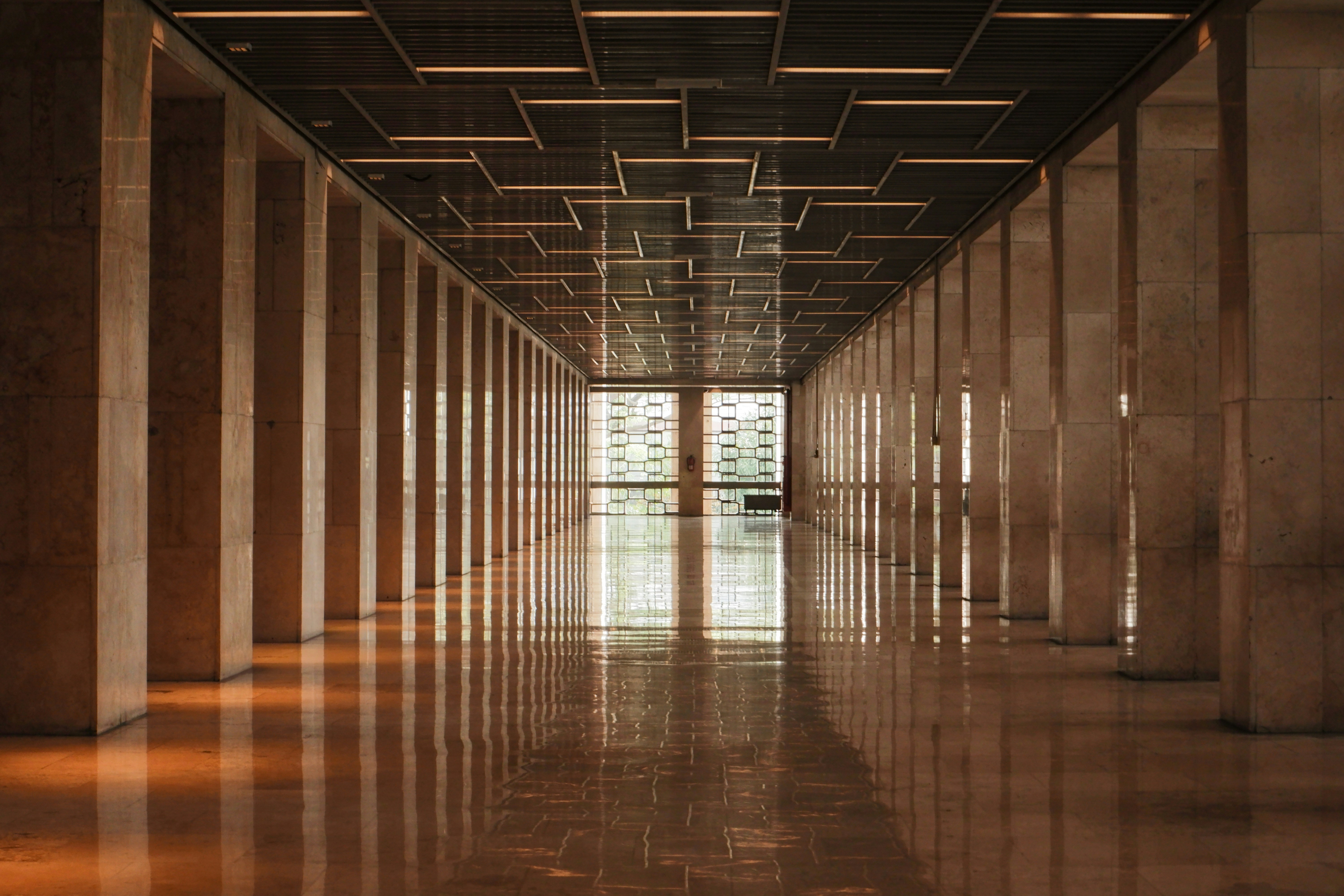 Echoes of Light: A Corridor of Columns and Reflections