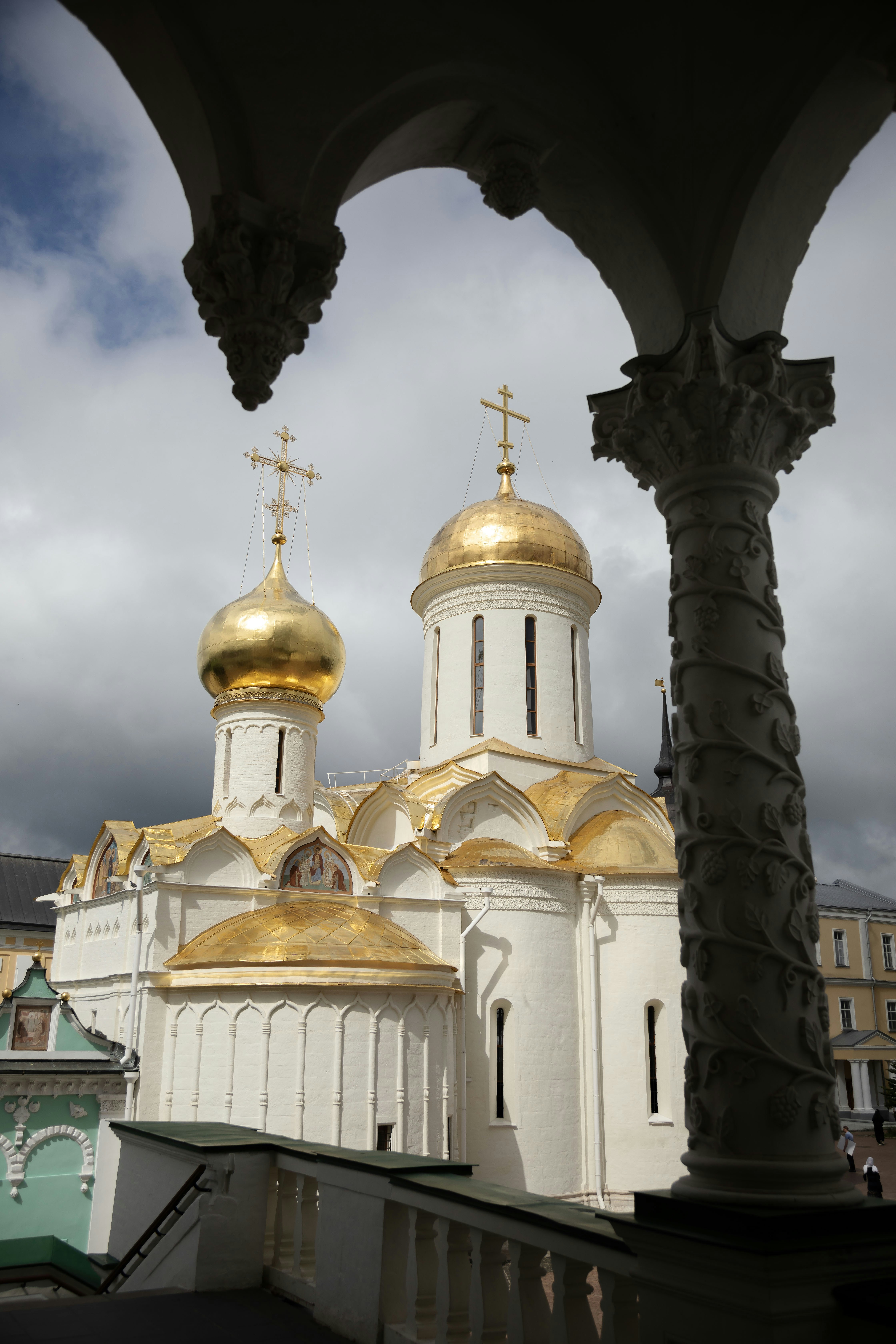 Golden Domes Under Ornate Arches