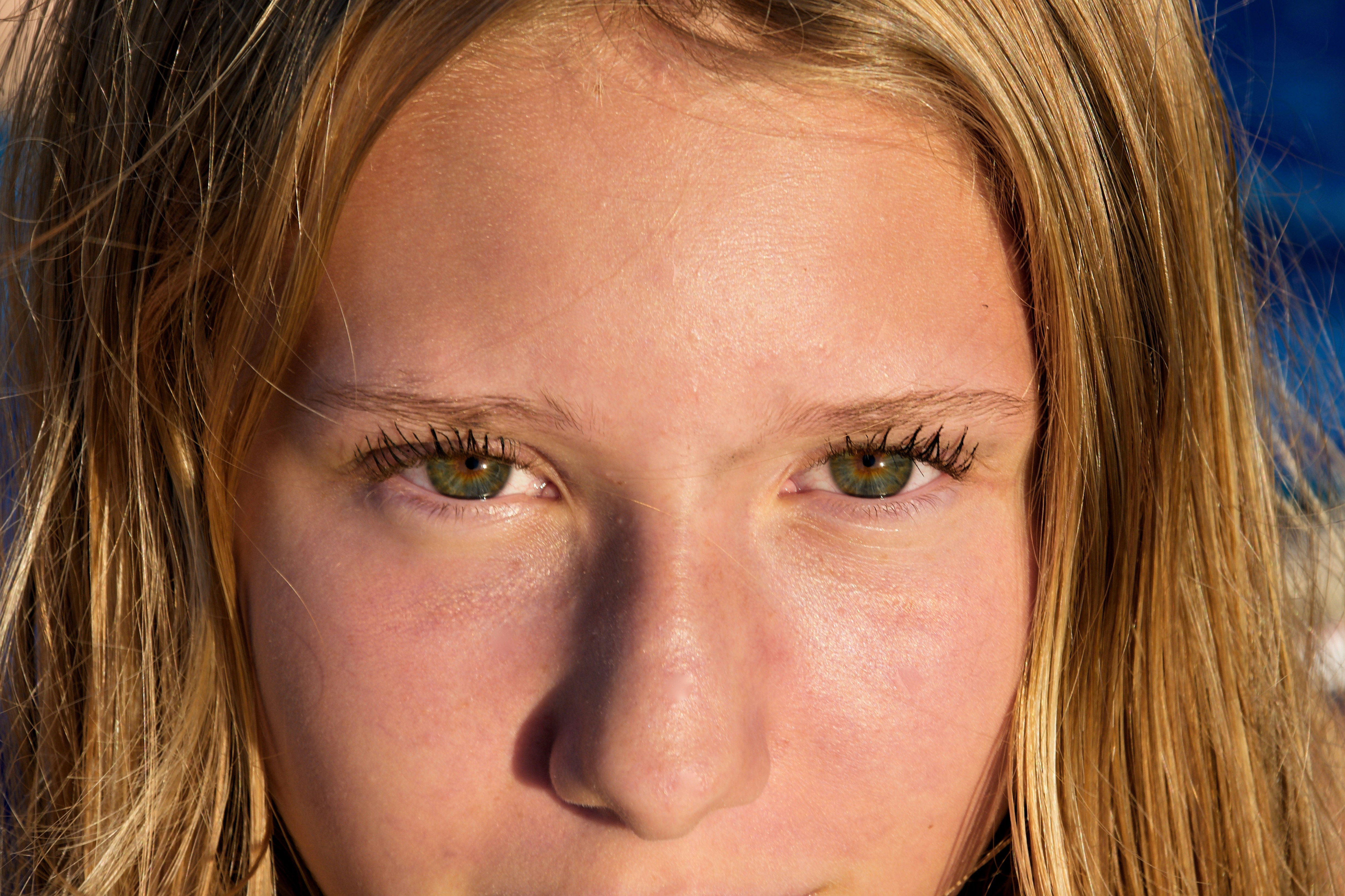 Close-Up of a Youthful Gaze Under Soft Sunlight