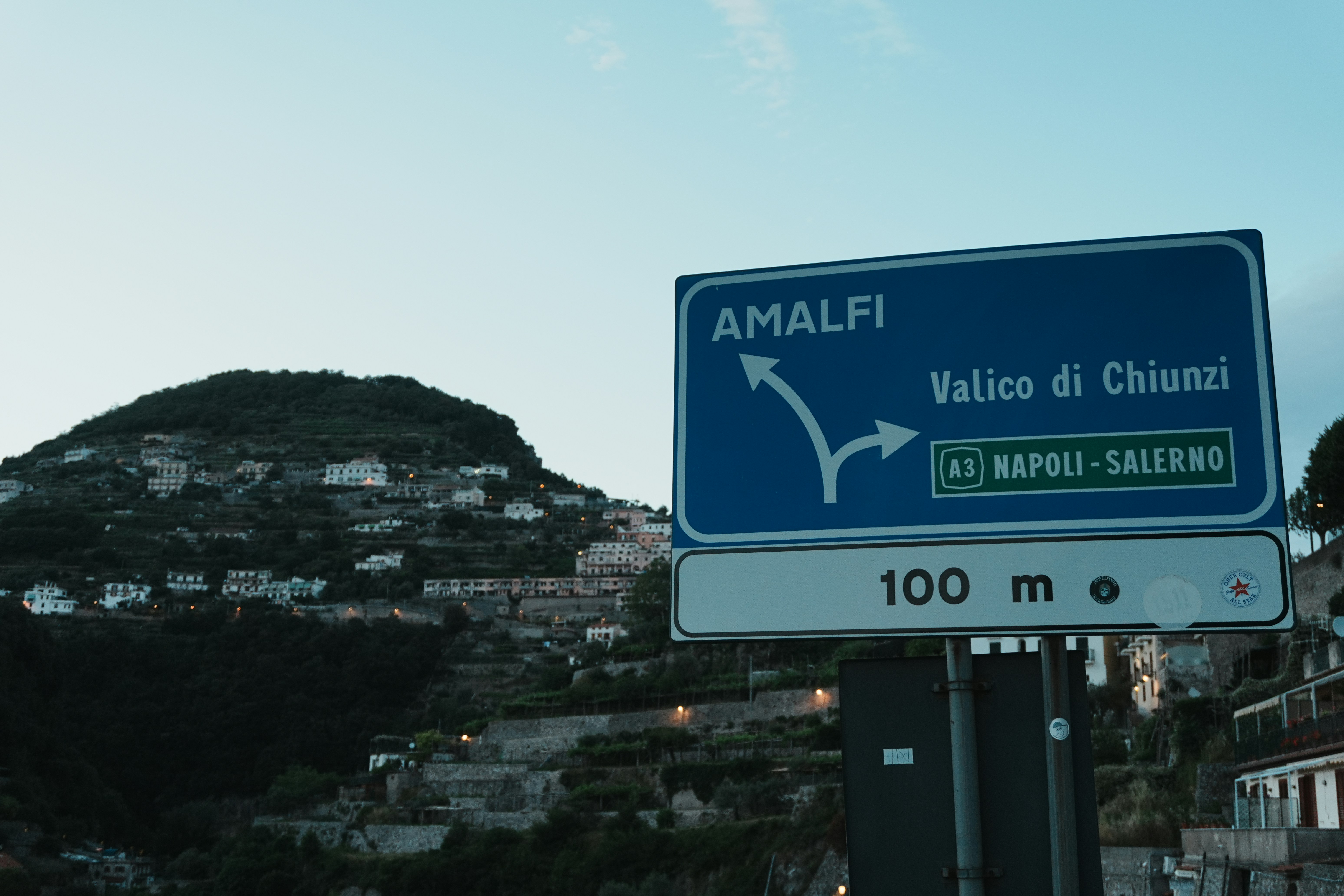 Signpost to Amalfi: A Coastal Horizon Beneath a Quiet Sky