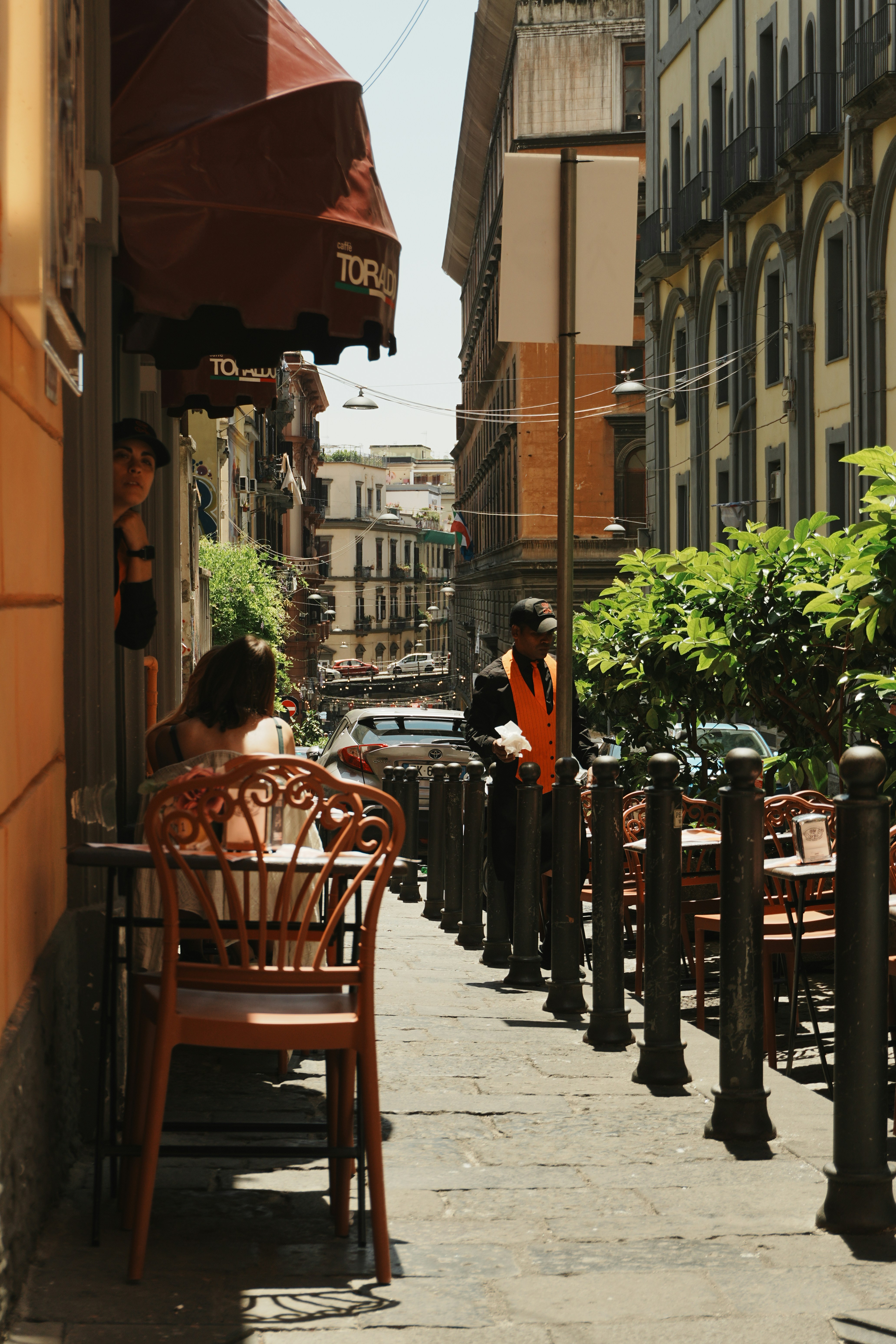 Cobbled Street Café Portrait Amid Urban Warmth