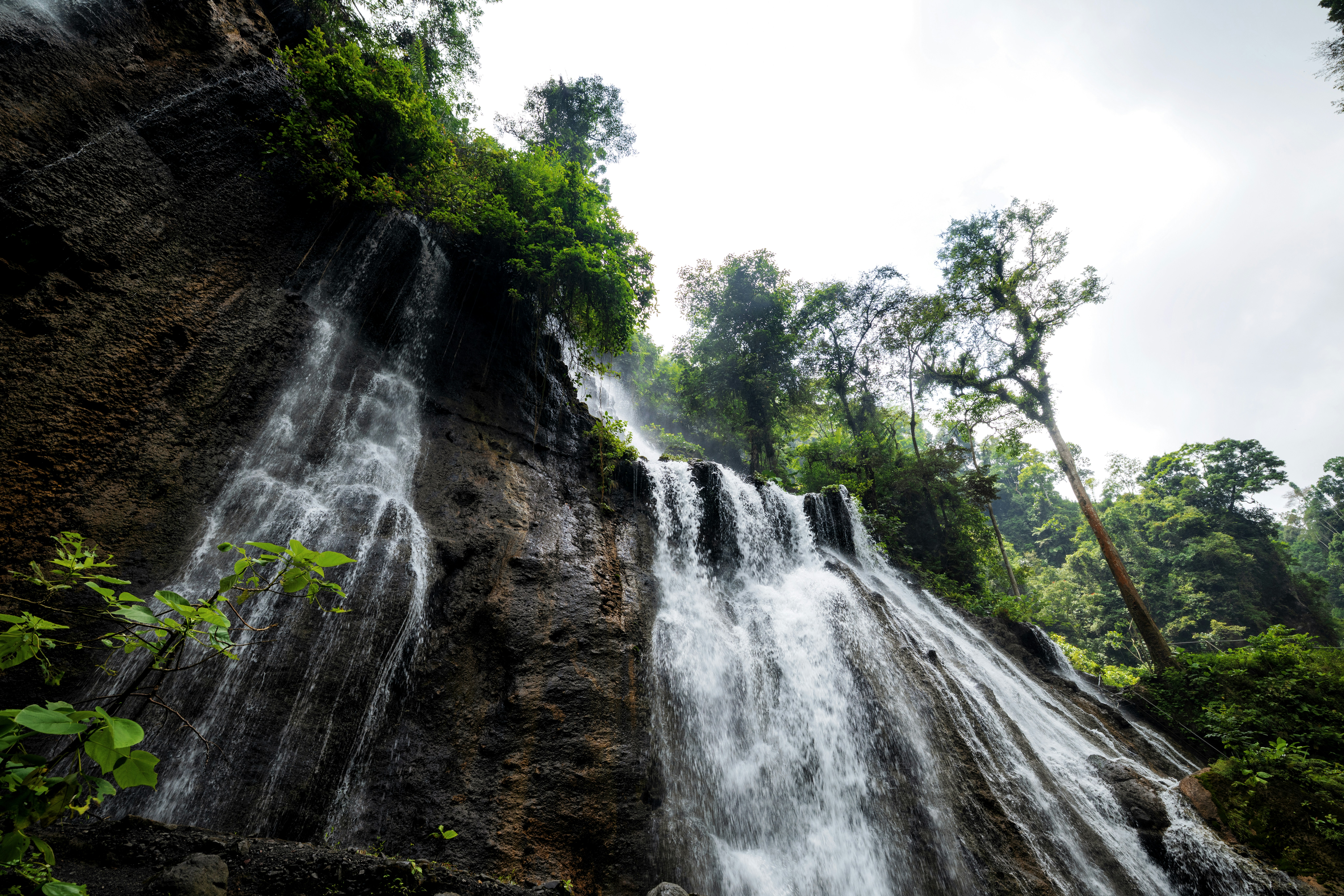 Tumbling Veil: A Cascade Over Dark Rock