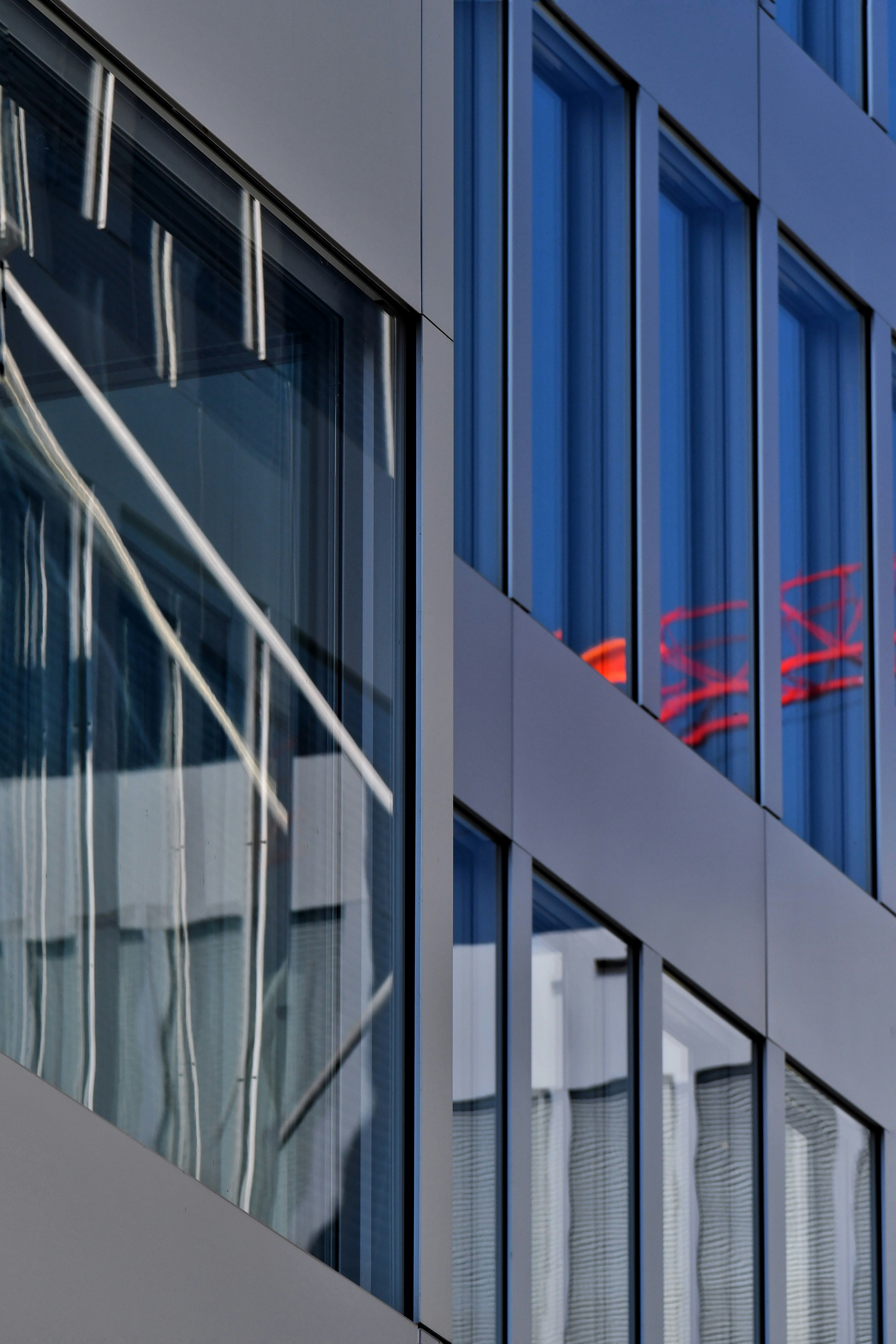 Glazed Facade Lines: A Geometric Portrait in Blue Steel