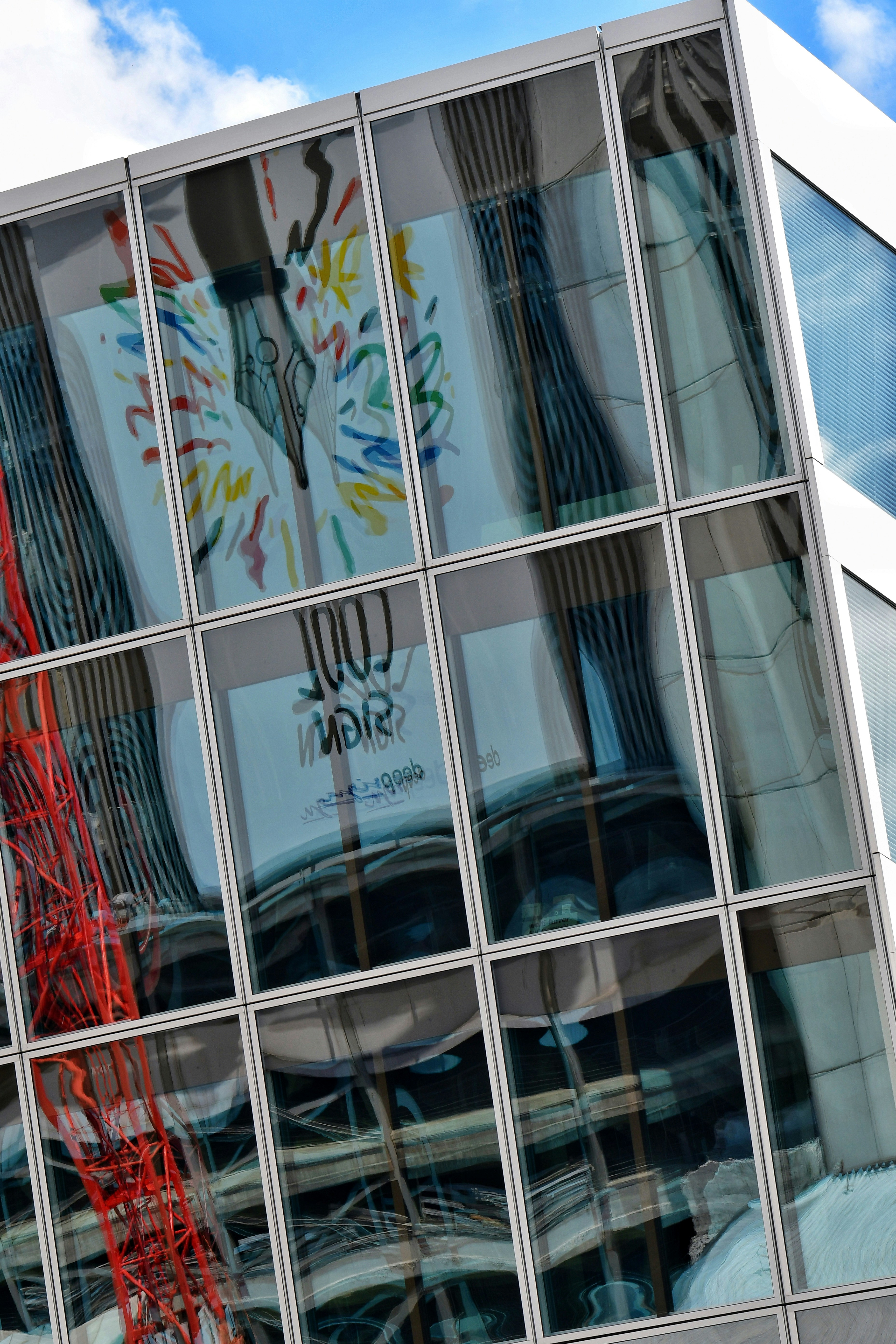 Facade Reflections: A Fragmented Glass Portrait