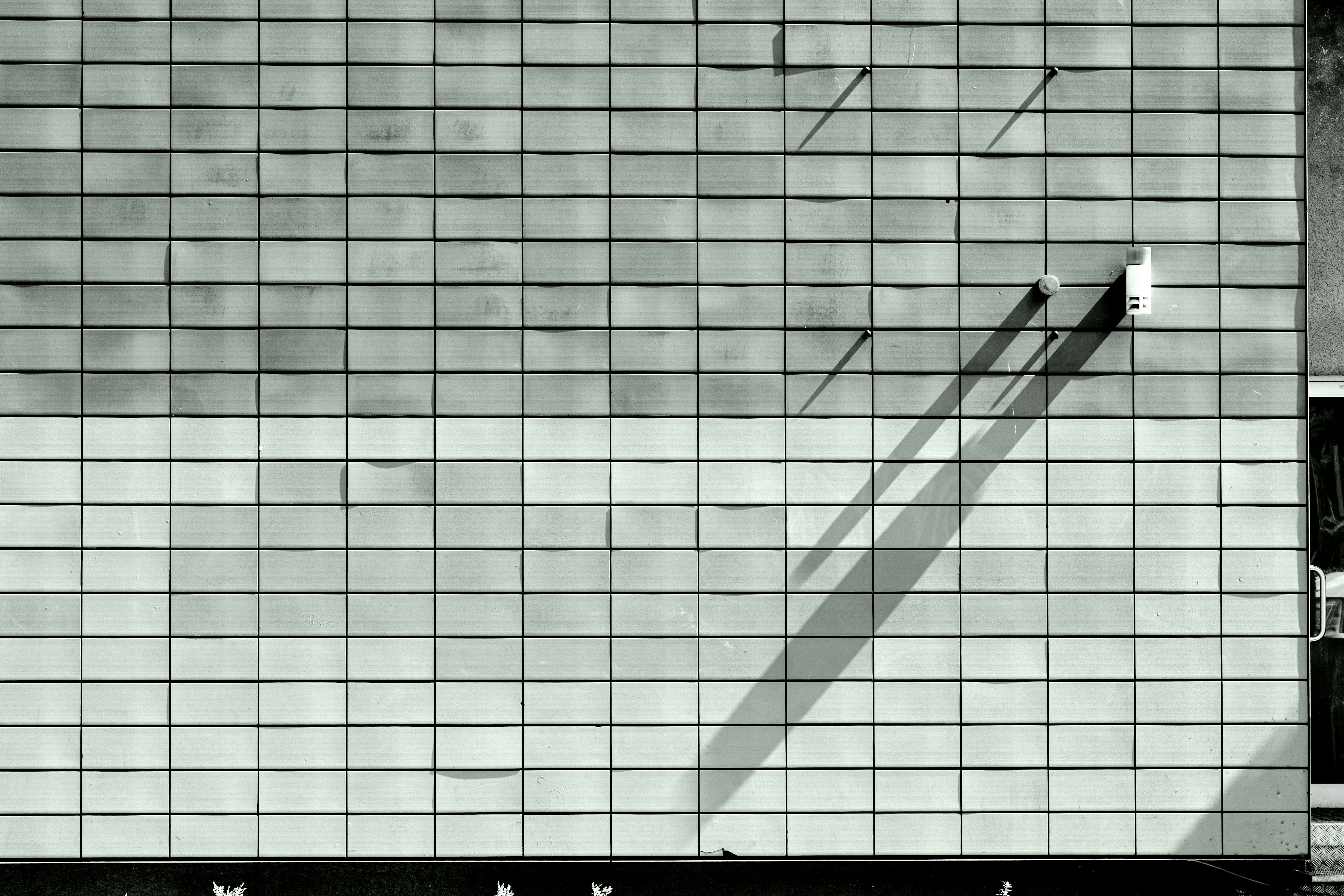 Long Shadow over a Tiled Facade