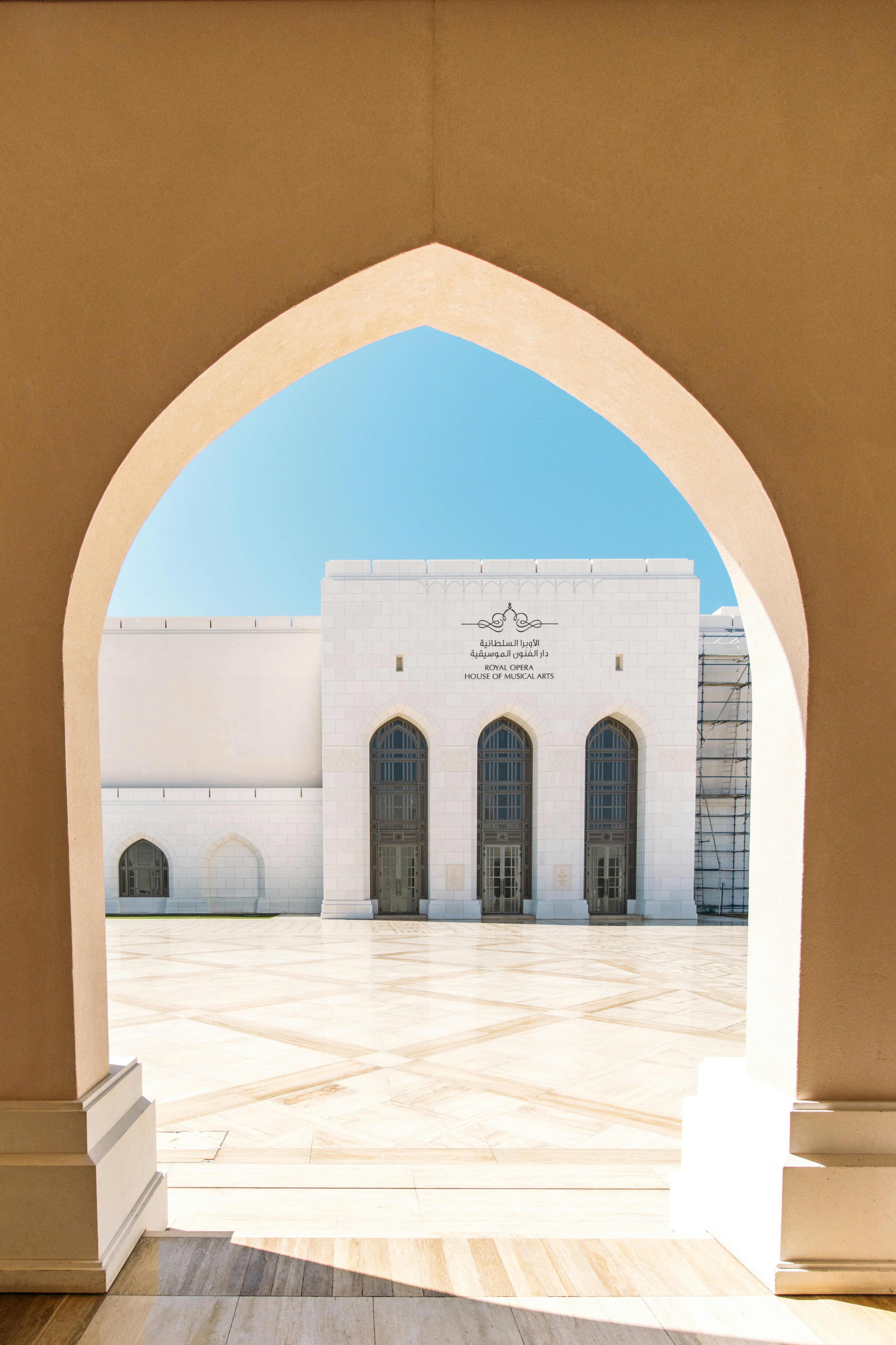 Through the Archway to a White Facade