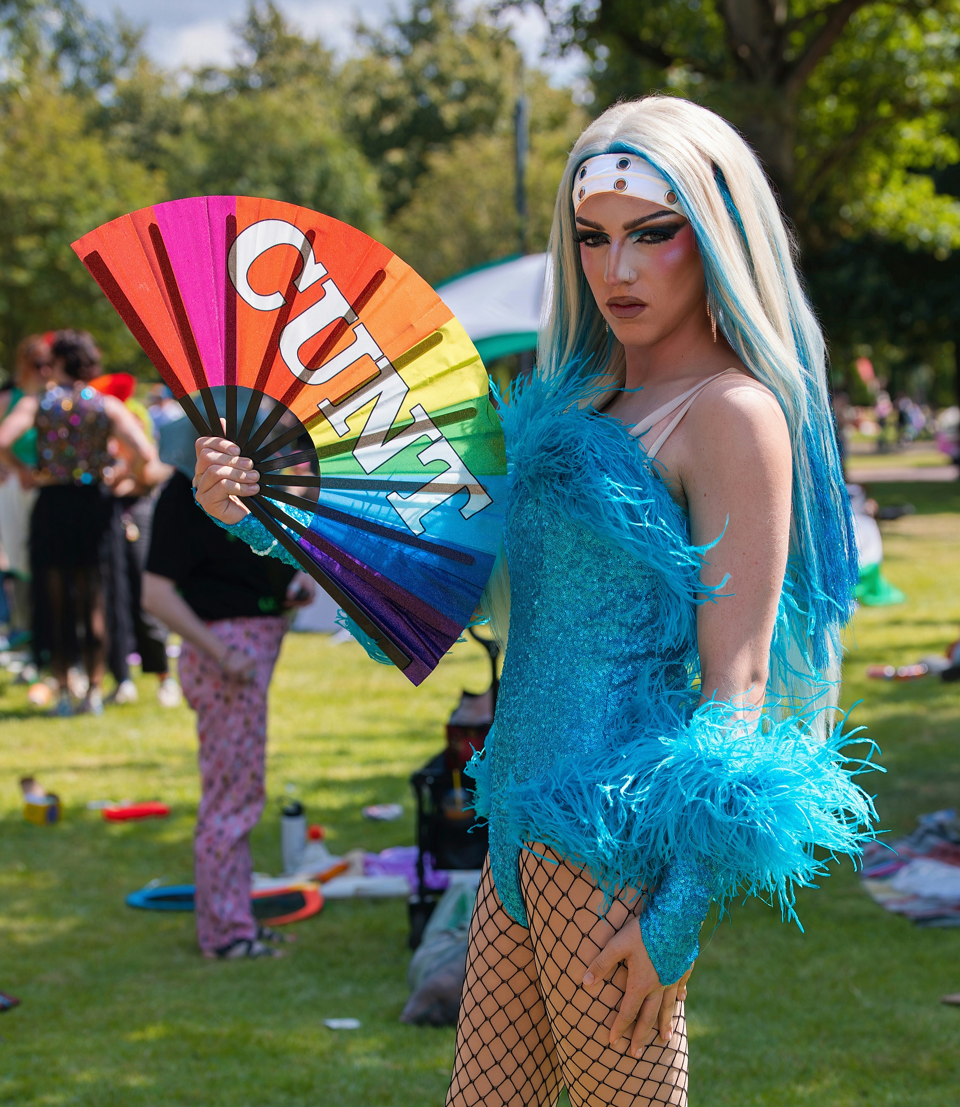 Blue Feathers in Color: Carnival Portrait with Rainbow Fan