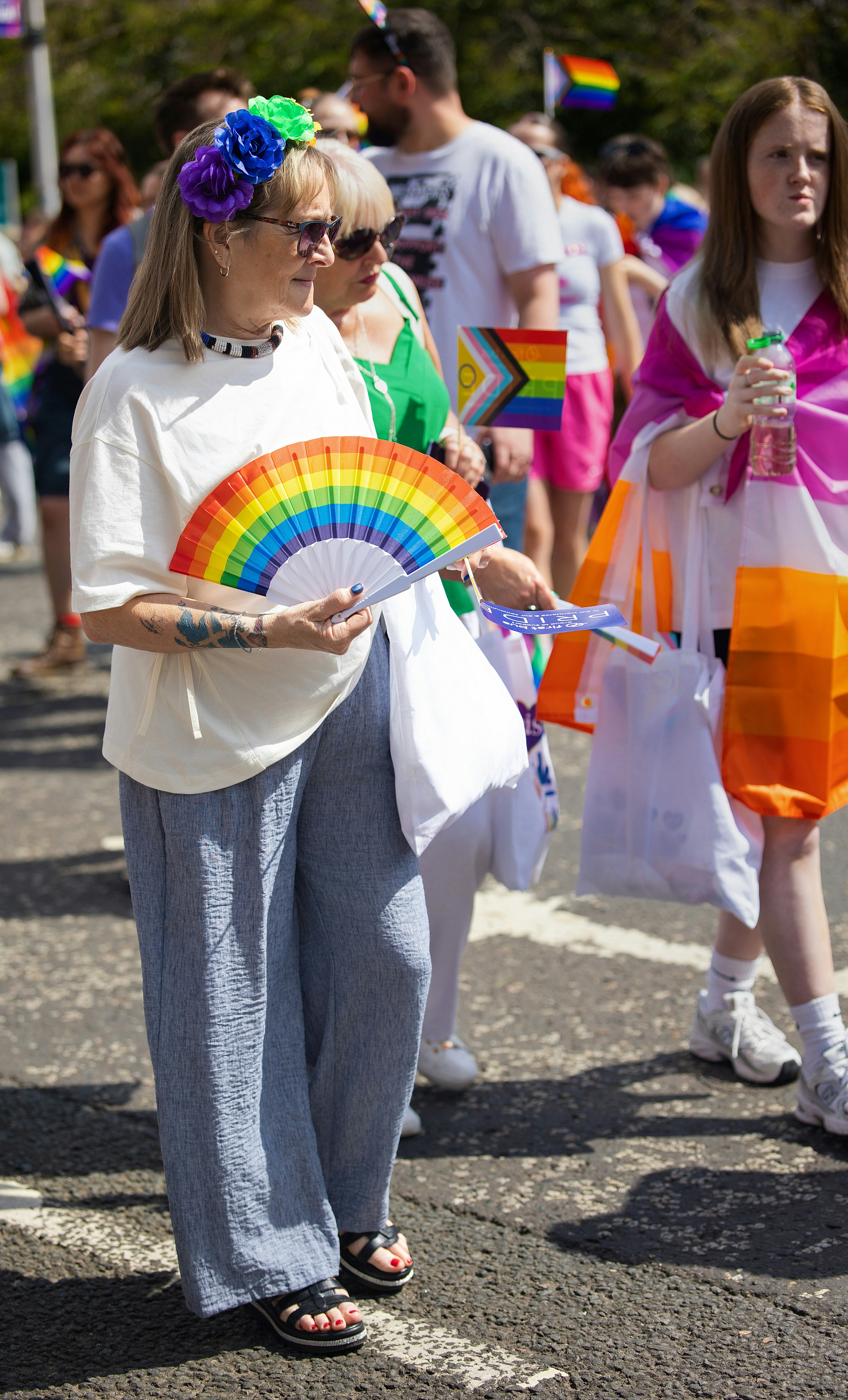 Rainbow Confetti in Hand: Pride Parade Moment of Color and Calm
