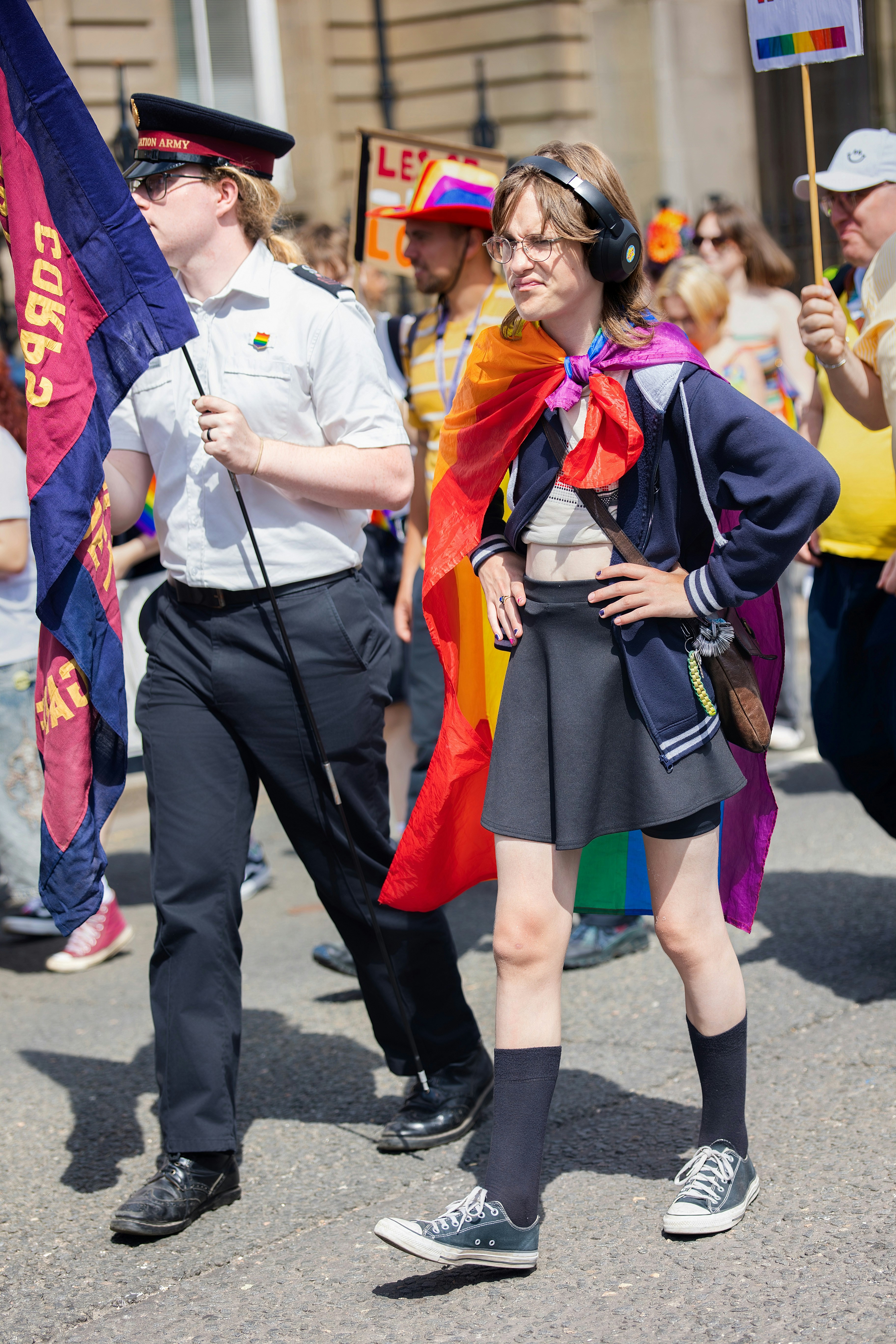 Rainbow Parade: A Student in Profile Amid the March