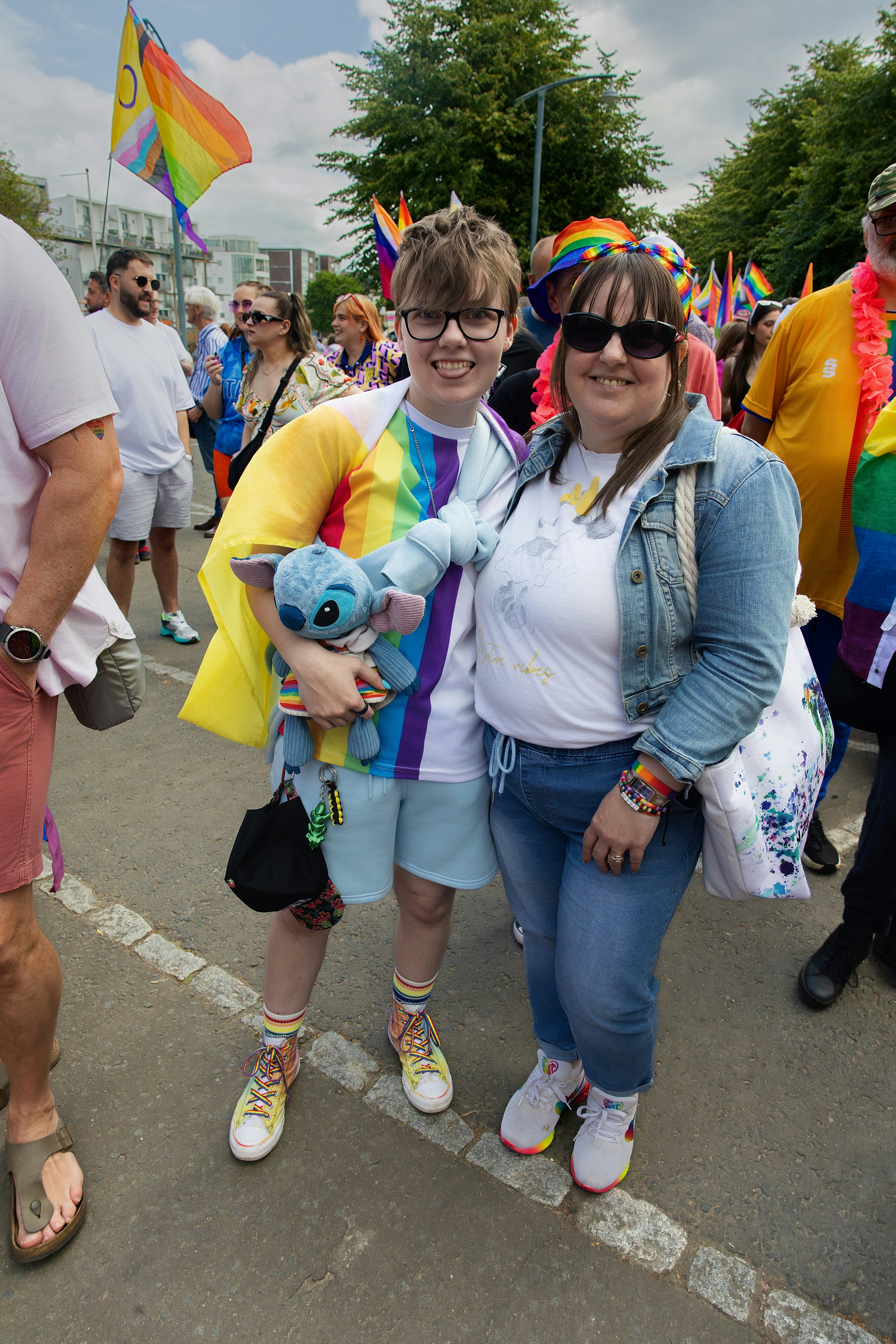 Rainbow Pride Duo at the Parade: Friendship in Focus