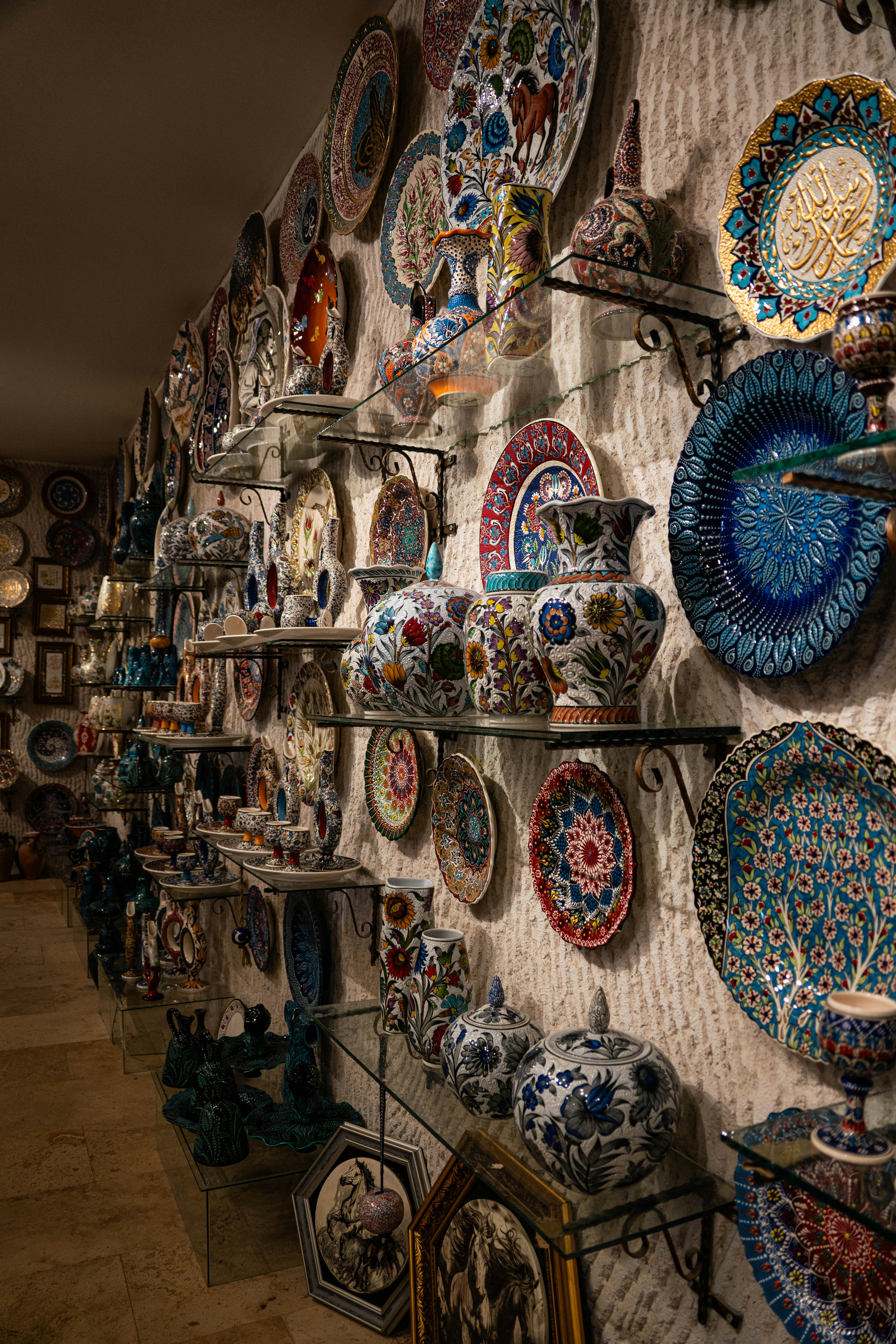 Shelves of Ceramic Echoes: a wall of colorful pottery