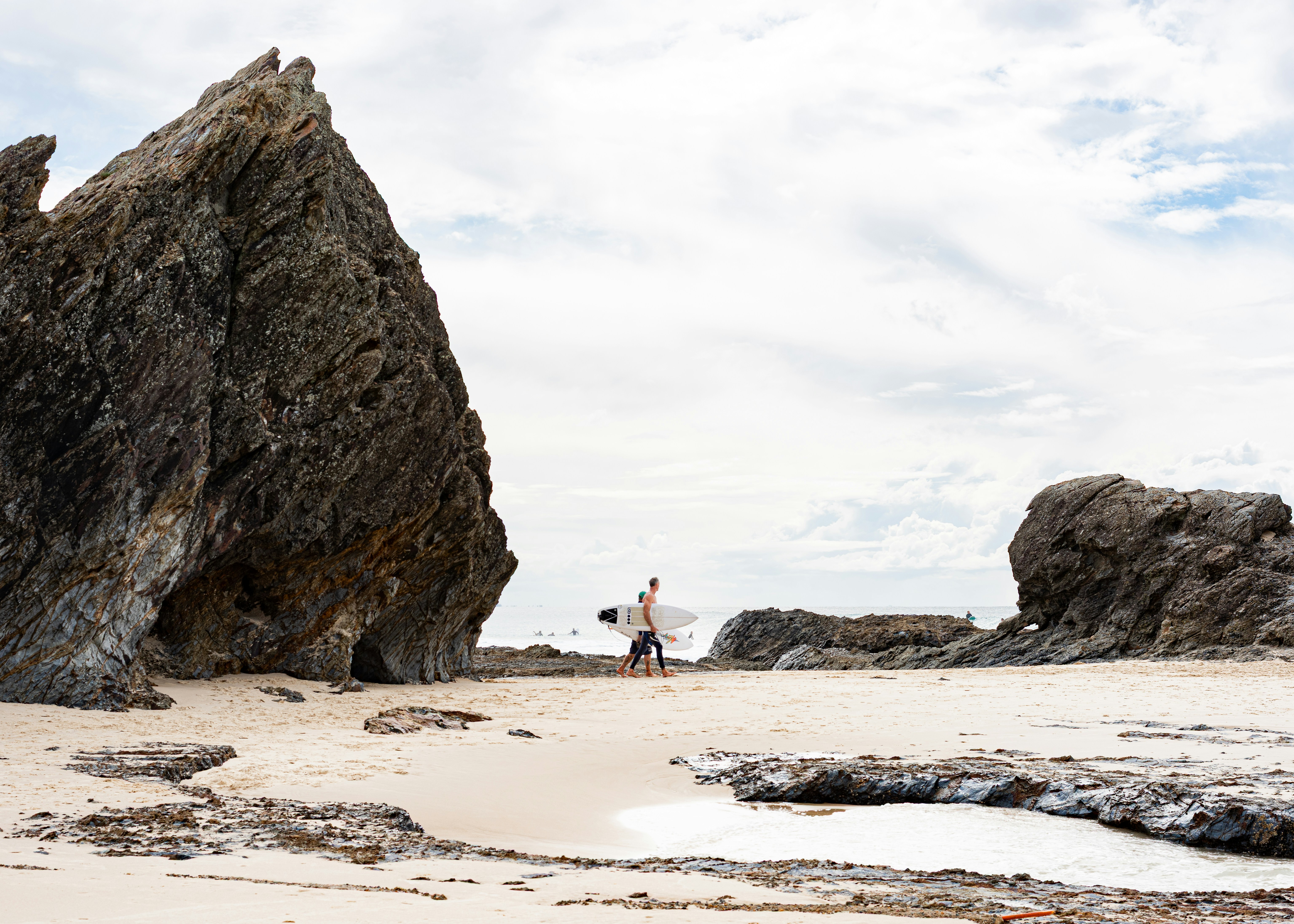 Surfer Return: A Lone Rider Returns Across Tidal Shadows