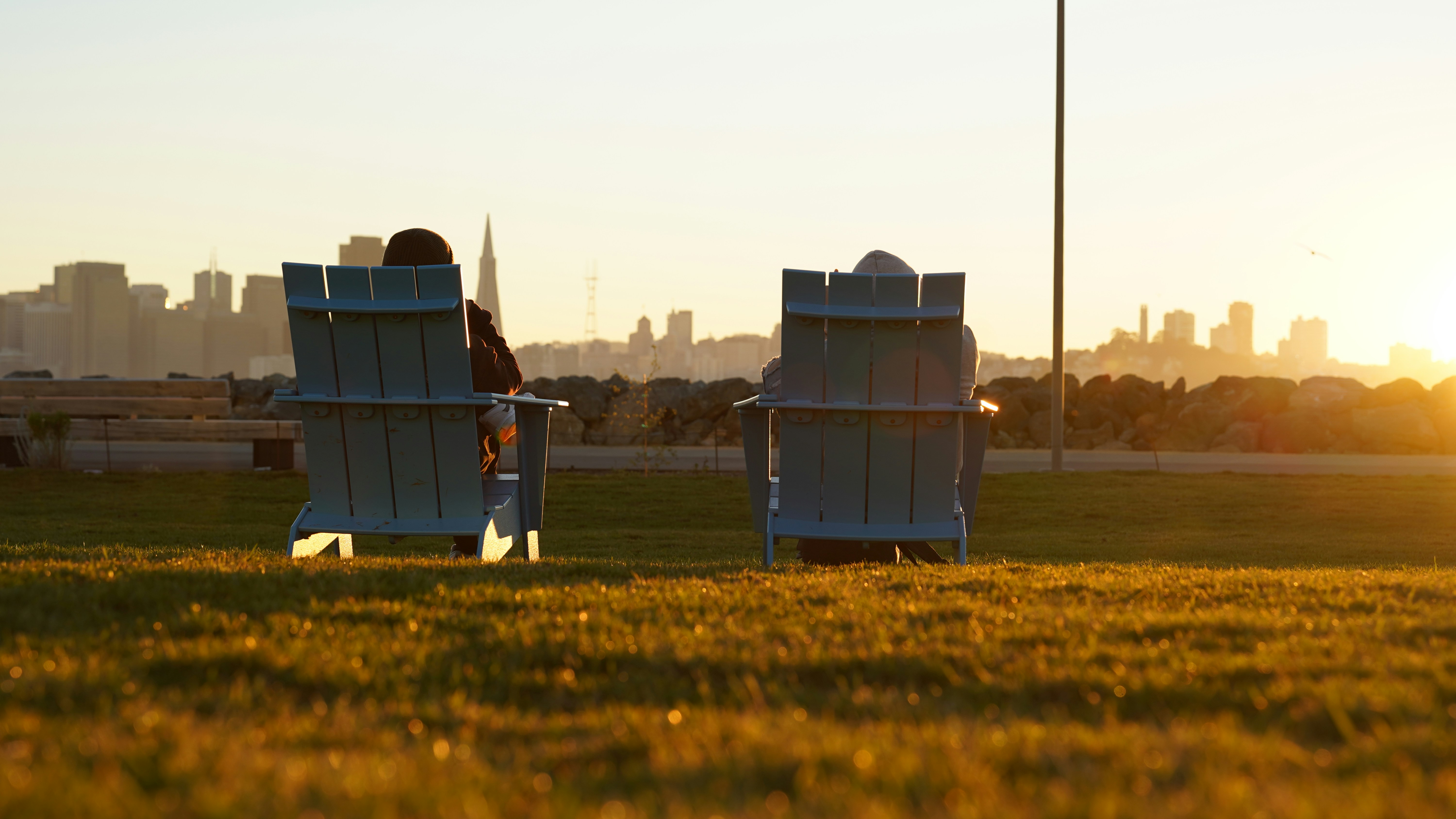 Two Blue Adirondack Chairs Watch the City Wake