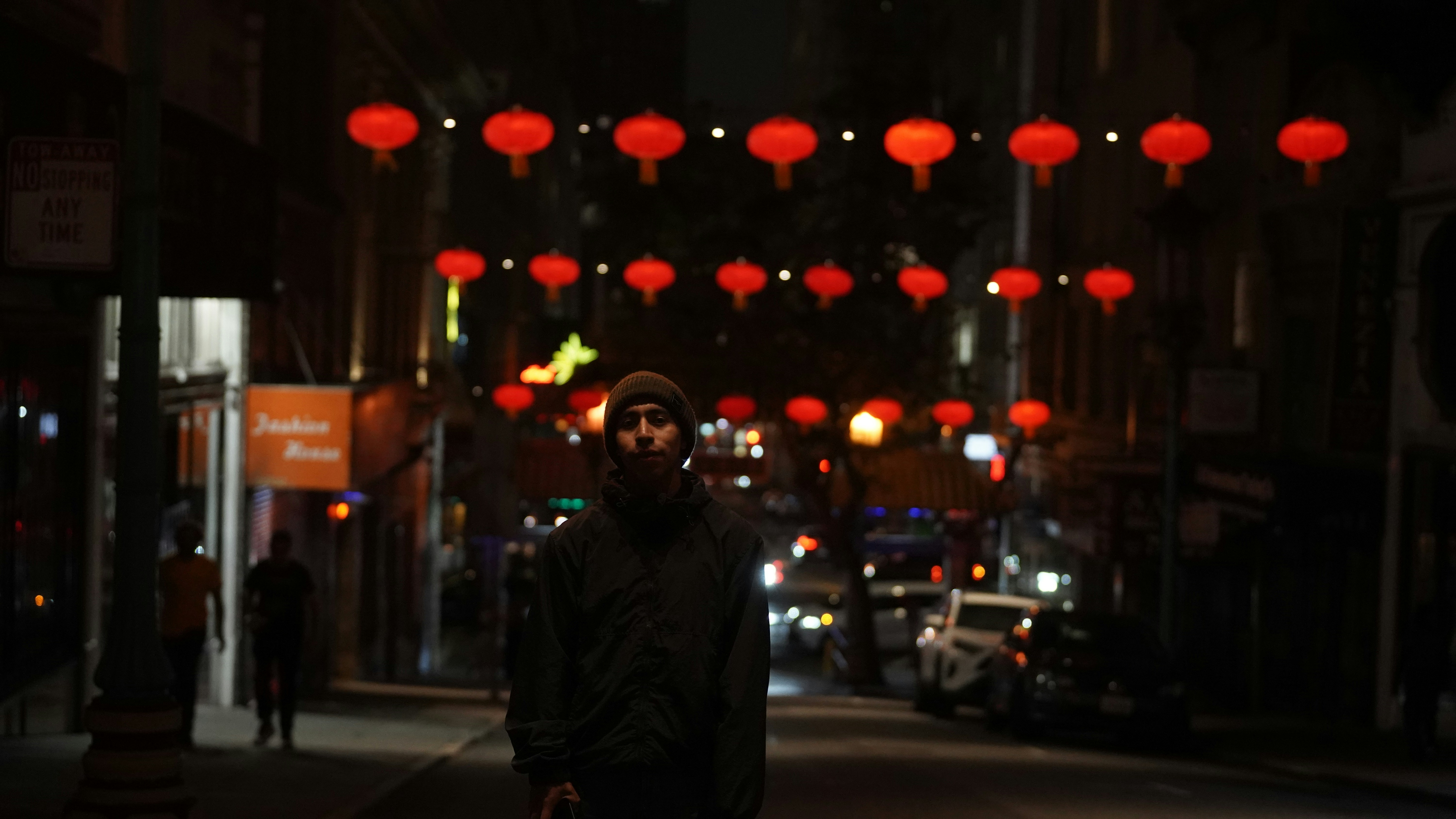 Lanternlit Street silhouette under a sea of red