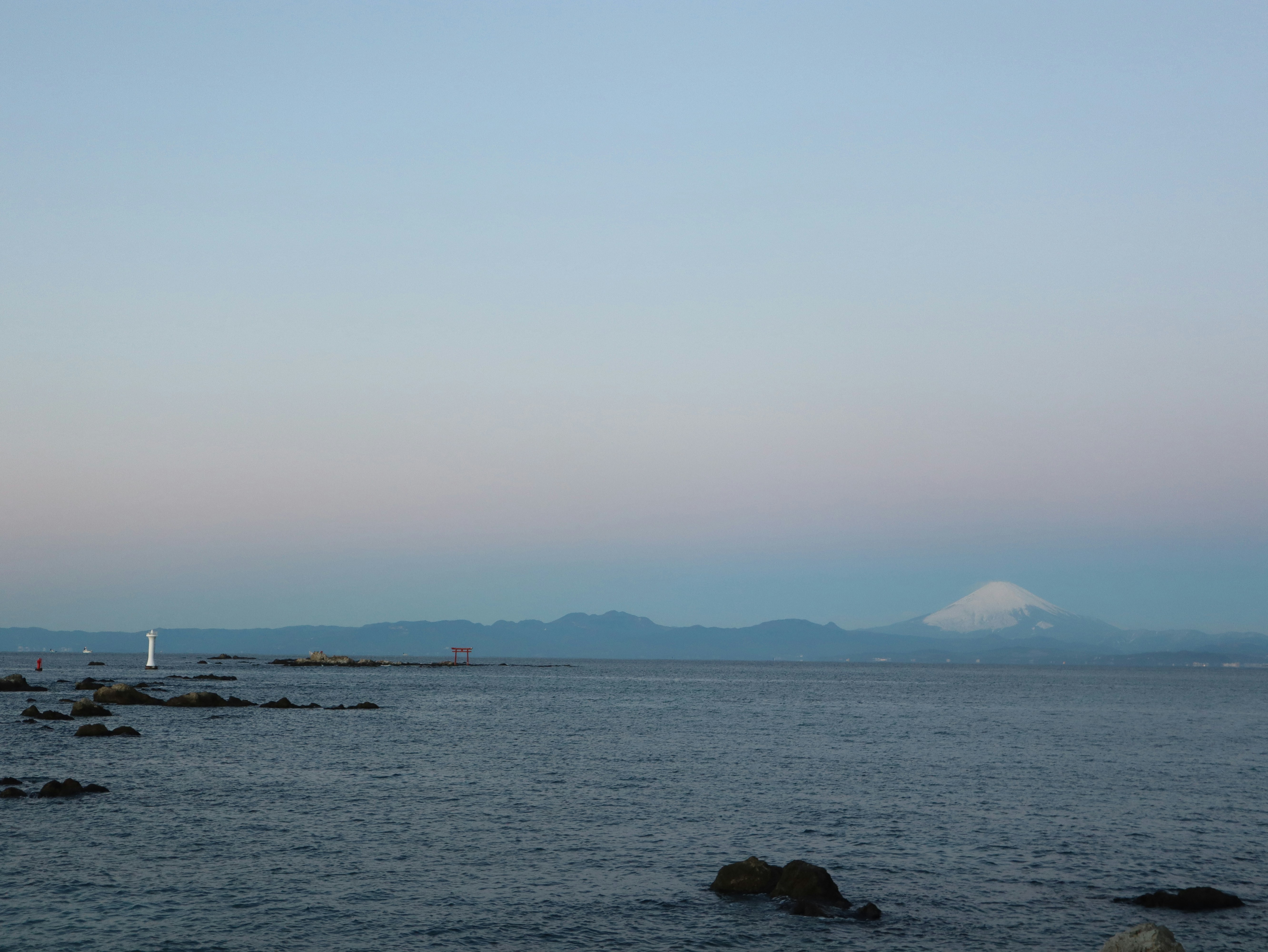 Horizon Quiet: Distant Peak Kept in Soft Light