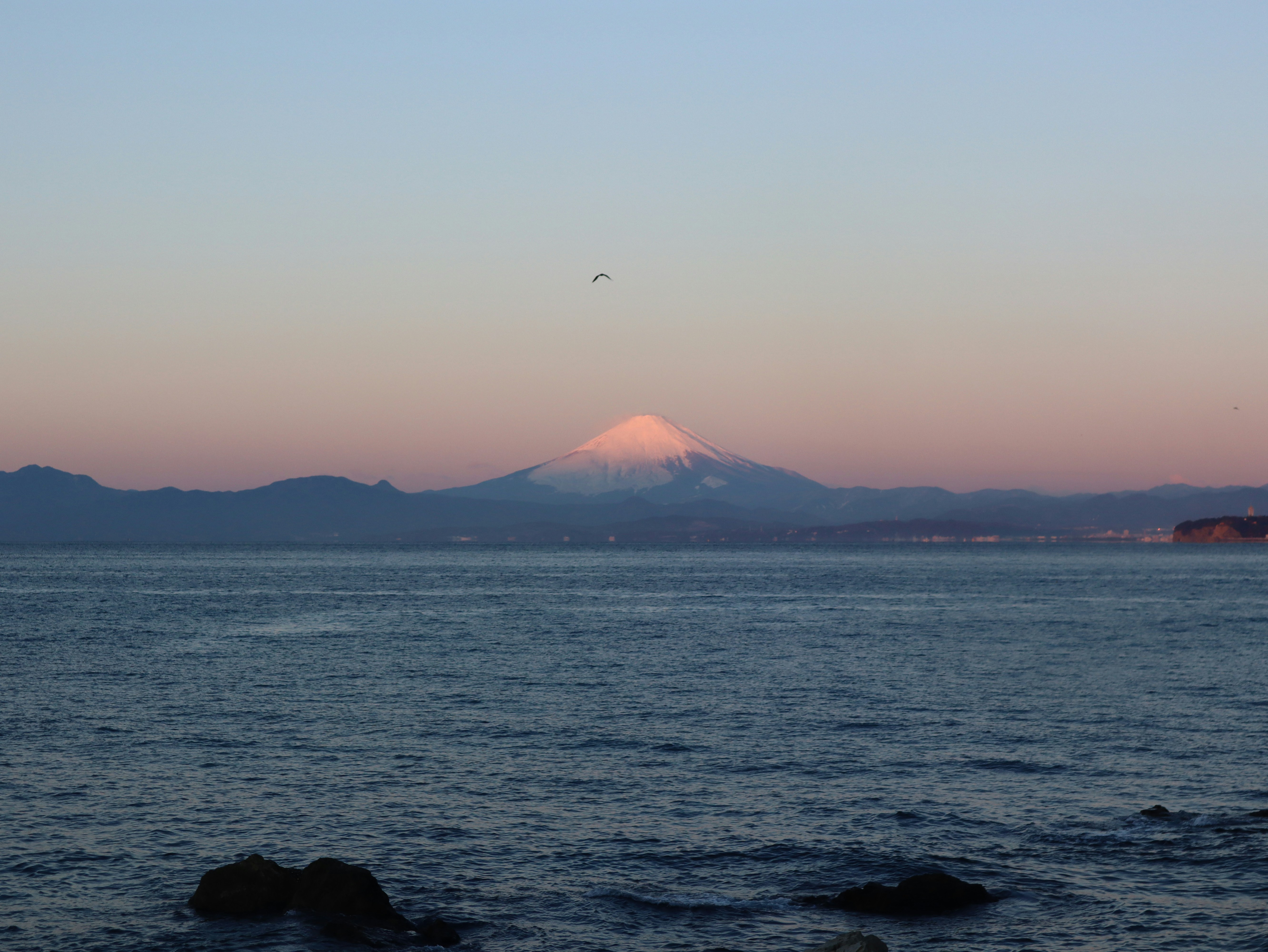 Silent Mountaintop over a Calm Sea at Dusk