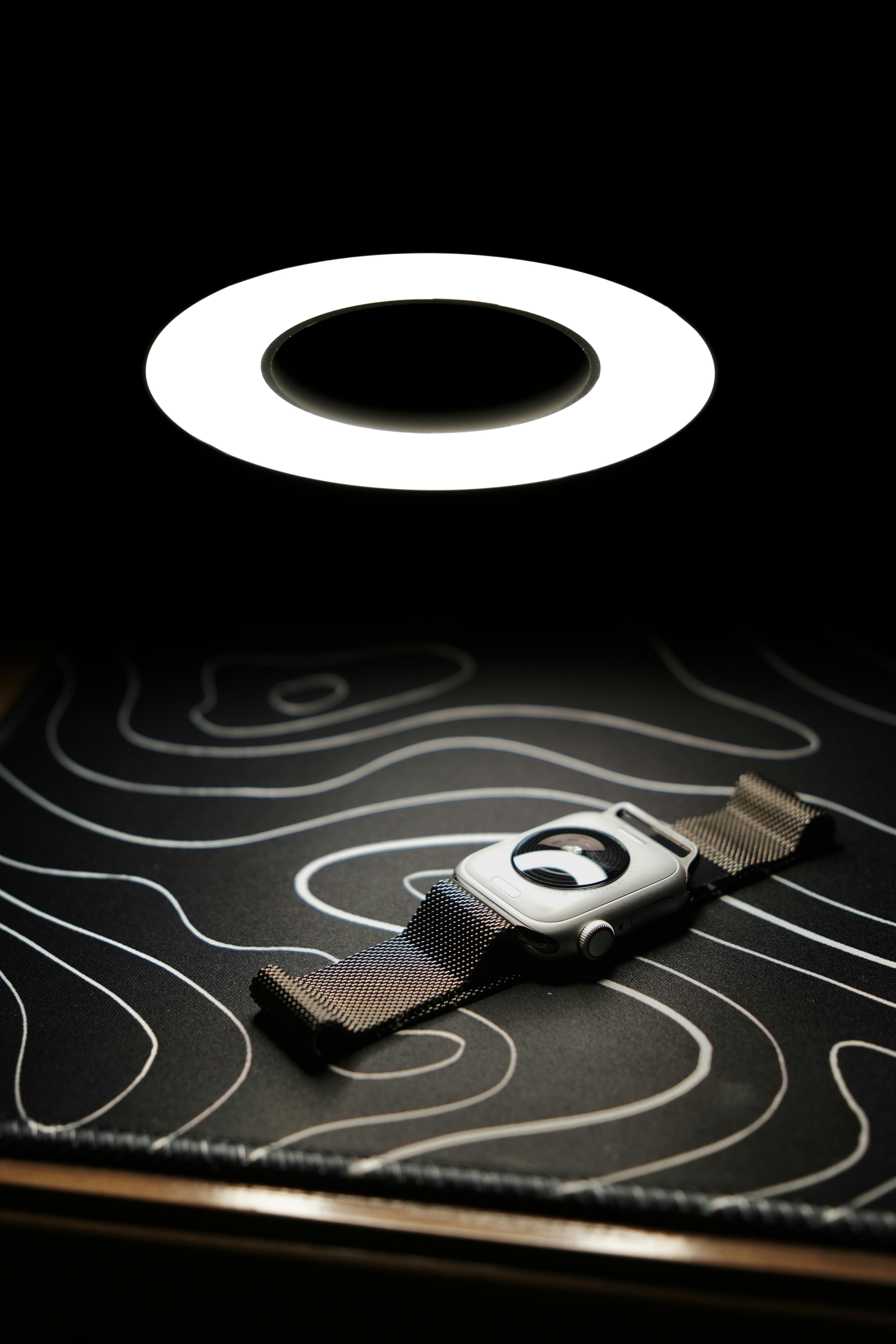 Circular Glow Over the Wristwatch: A Quiet Studio Moment
