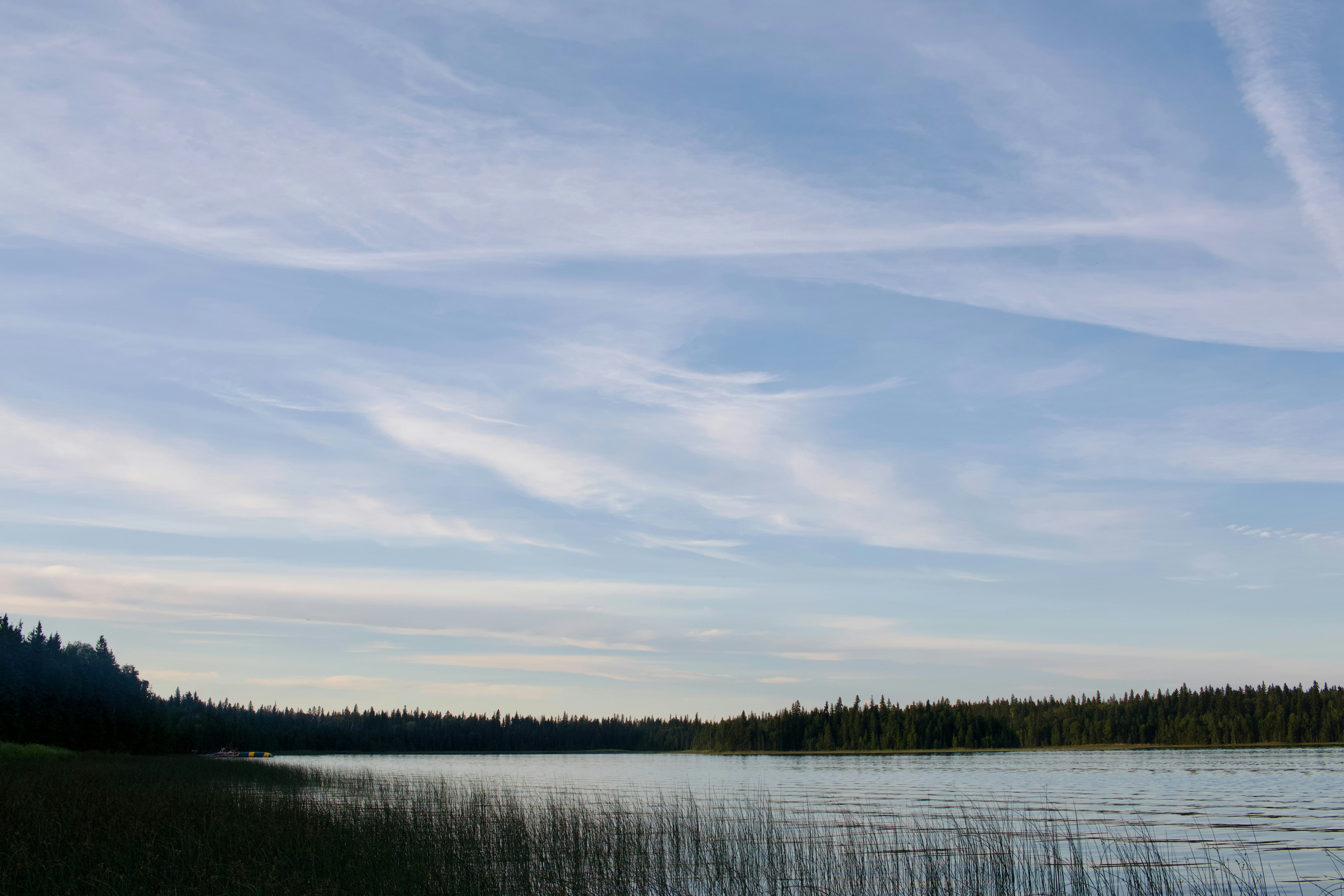 Quiet Ridge Lake at Dusk: A Horizon of Calm Water