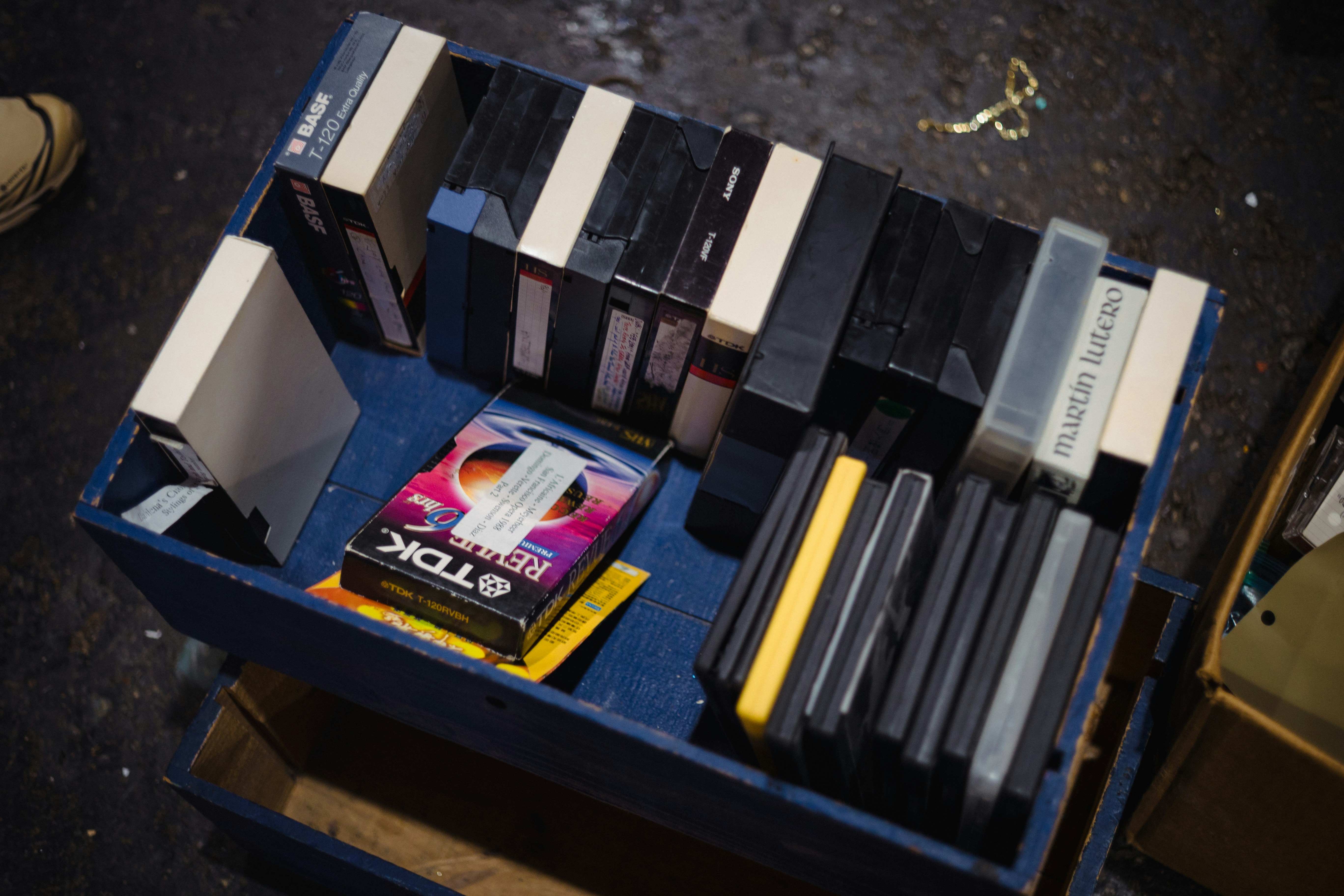 Dusty Archive of Film and Fable: A Portable Library in a Blue Crate