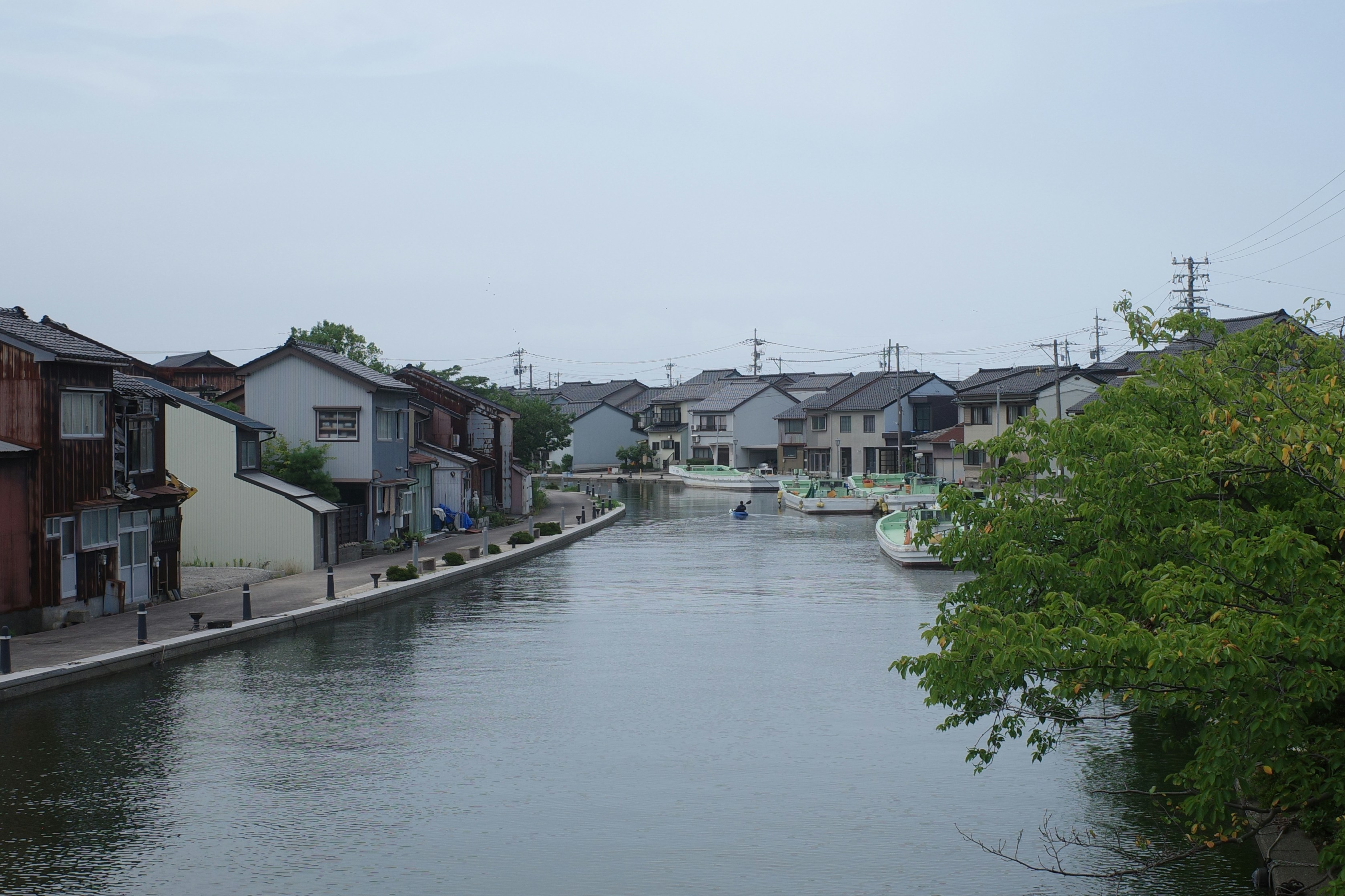 Waterway Village: Quiet Canal Framed by Riverside Homes