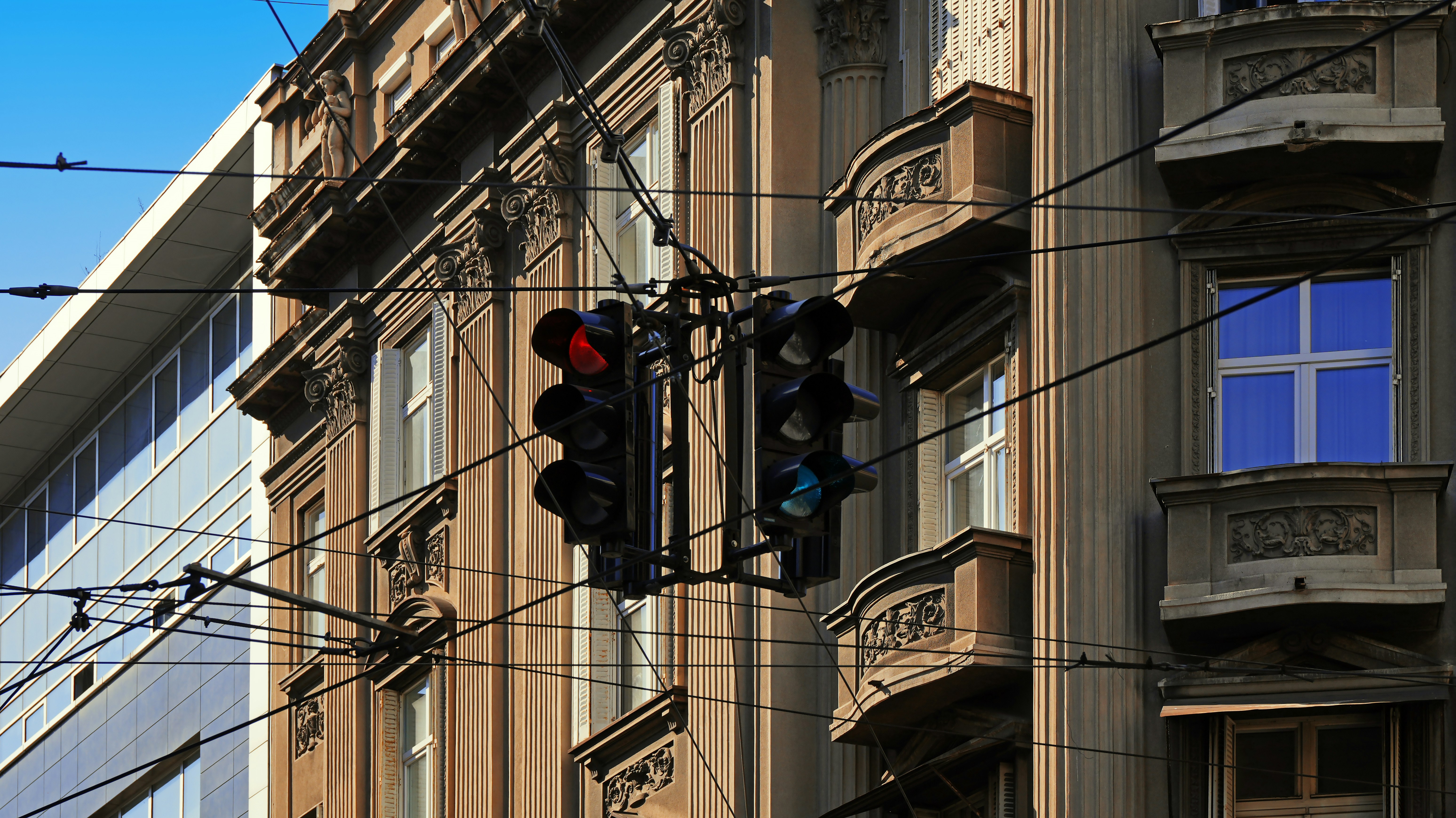 Crossroads of Steel and Stone: Tram Cables Framing a City Intersection