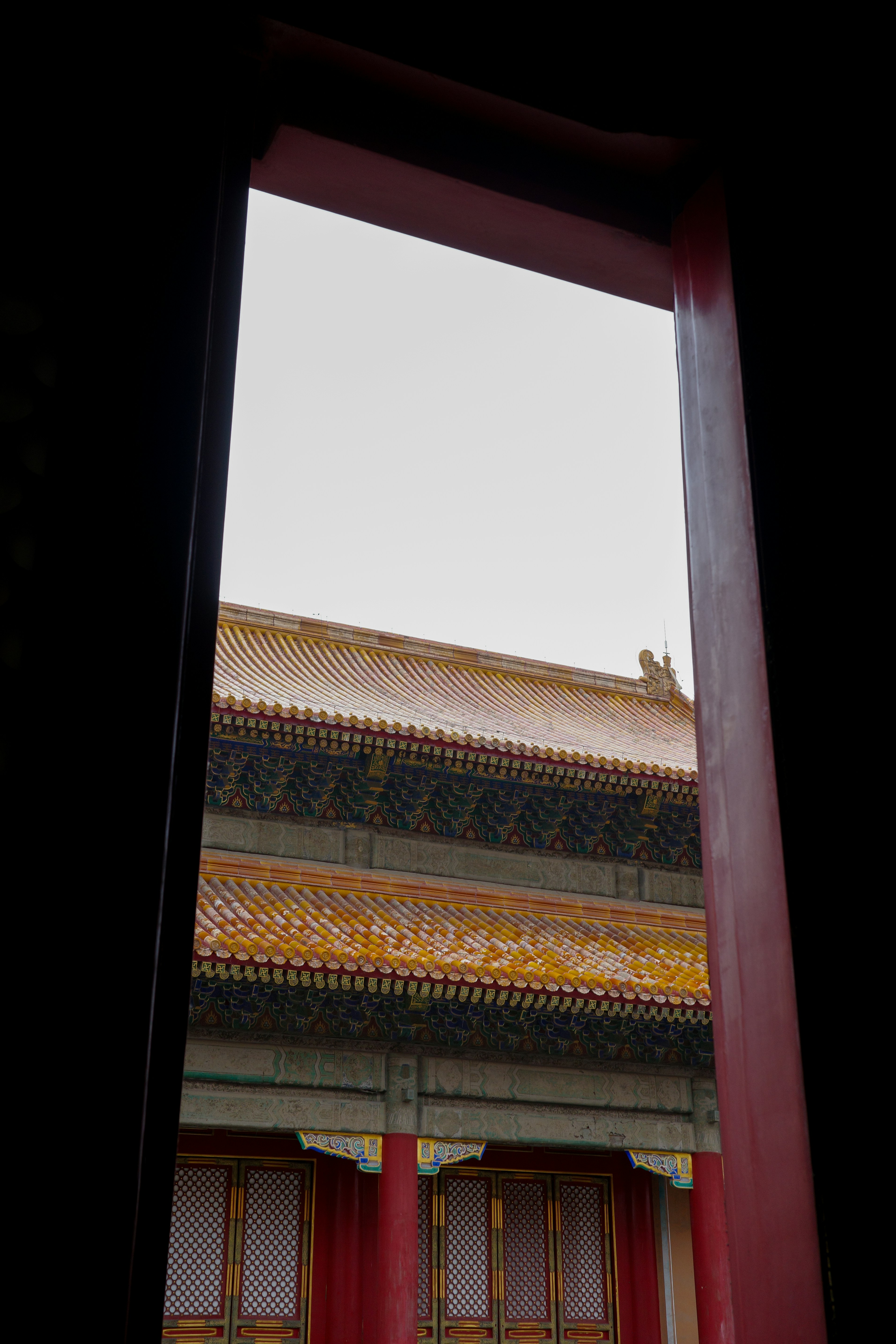 Through a Ring of Red: Framing a Peak of Painted Roofs
