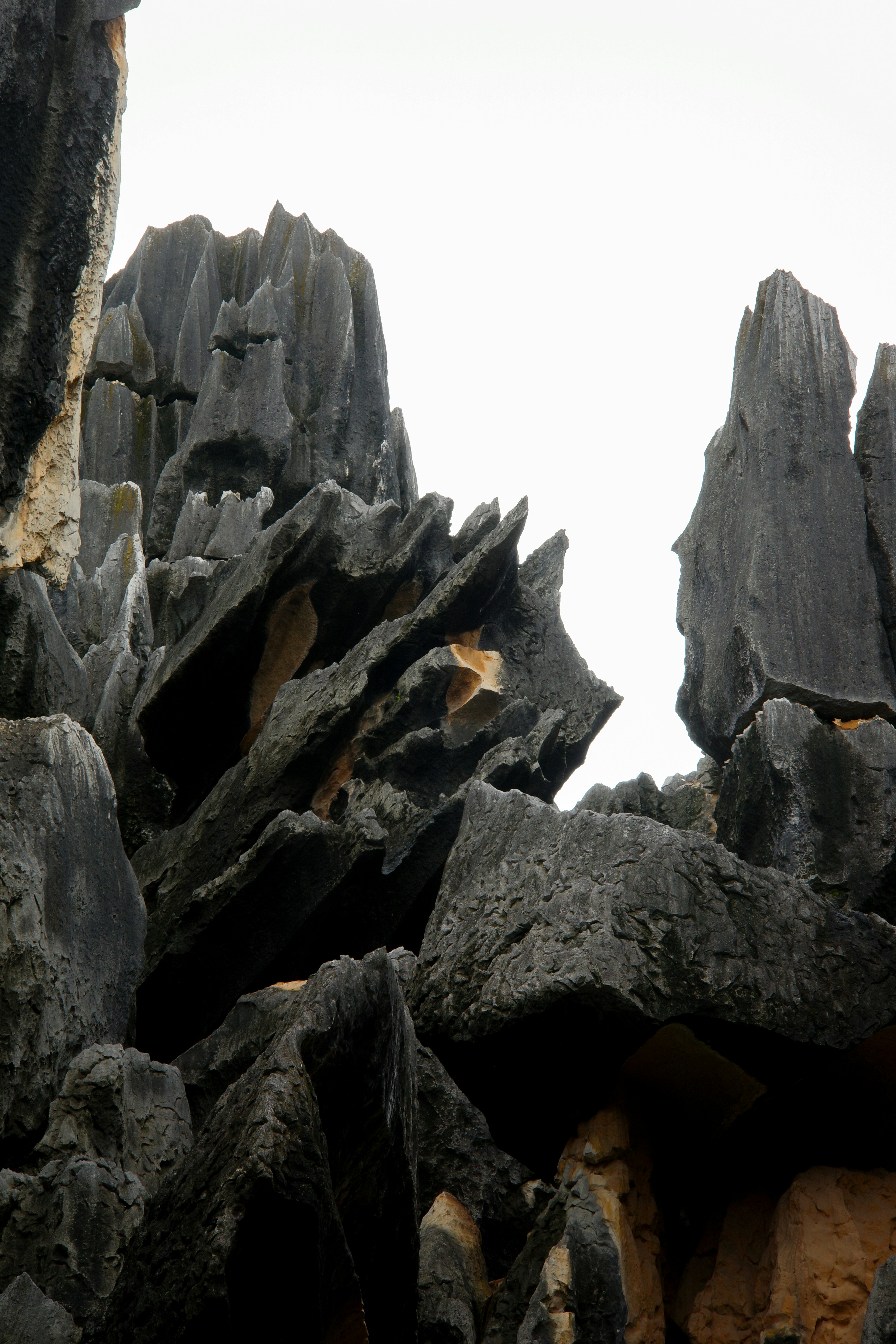 Rugged basalt spires piercing a pale sky