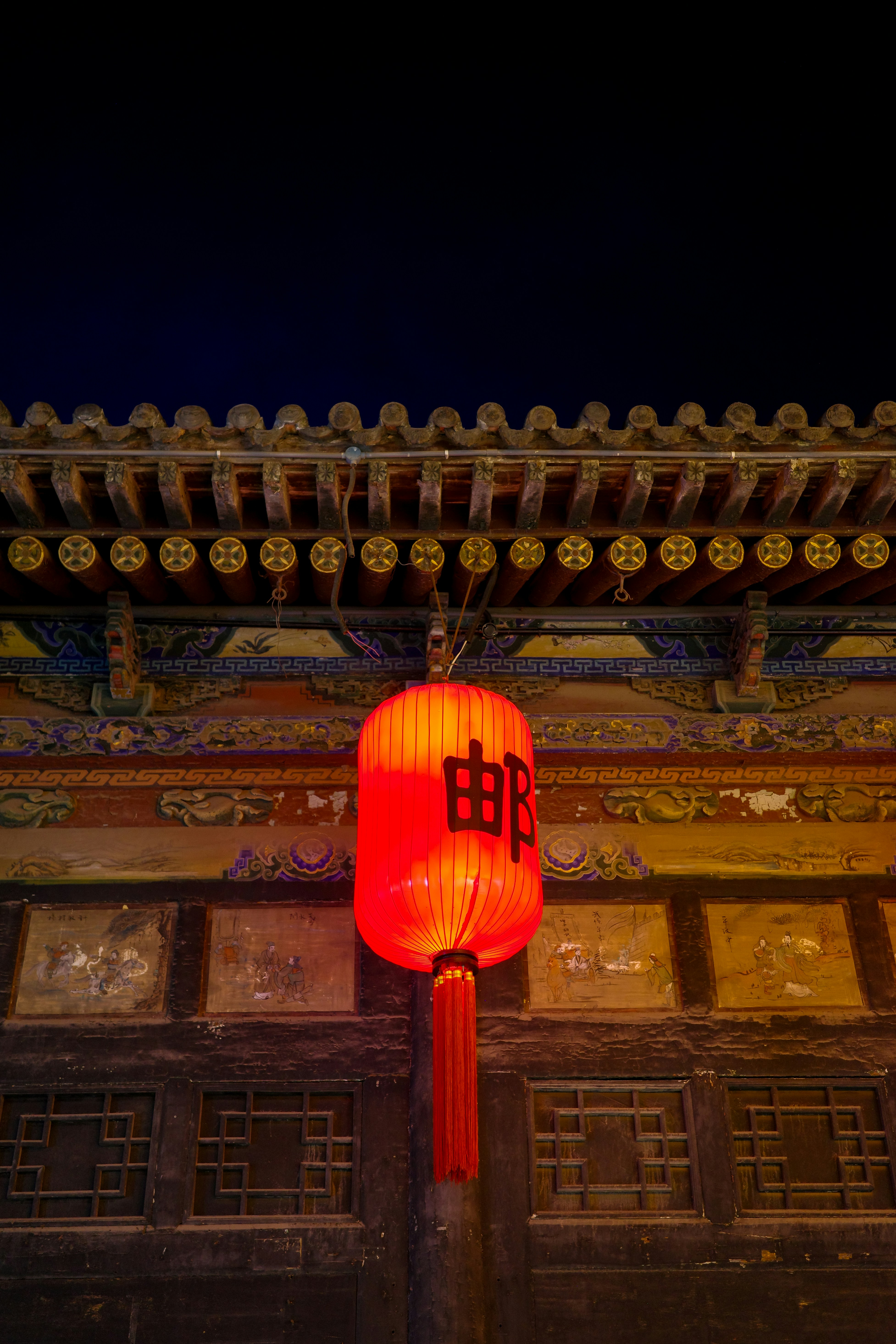 Red Lantern Lanterns Over Ornate Timberwork in Night Temple