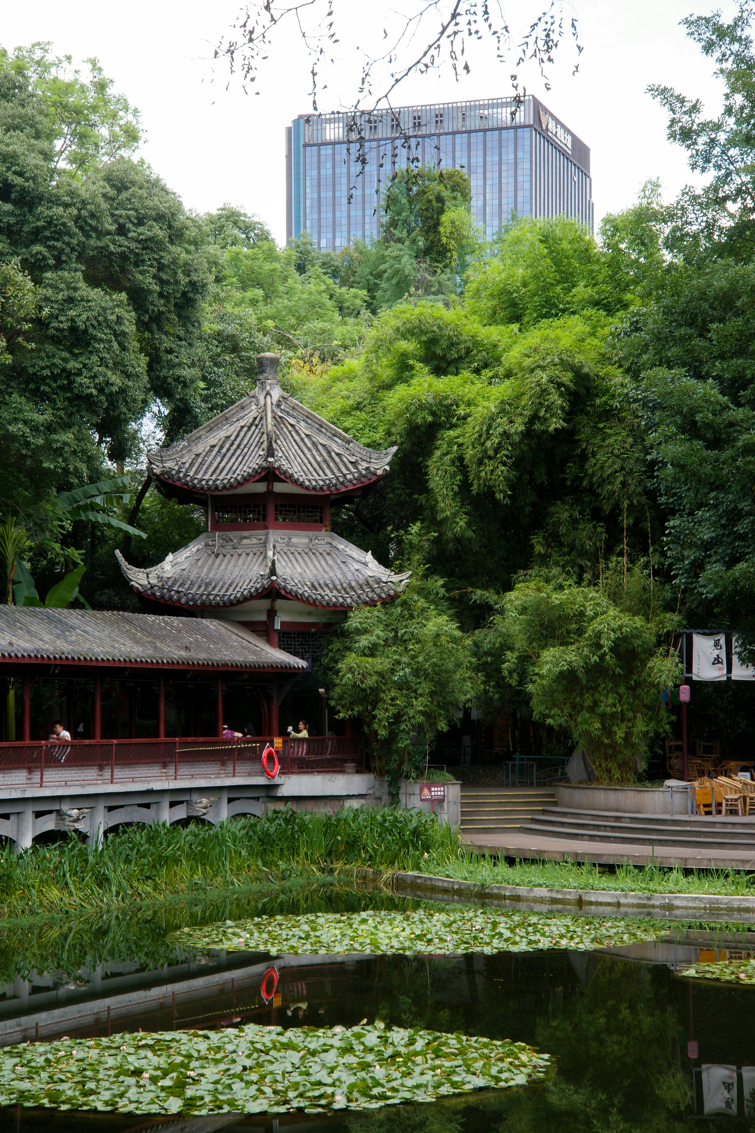 Harmony of Stones and Steel: A Traditional Pavilion Amid City Green