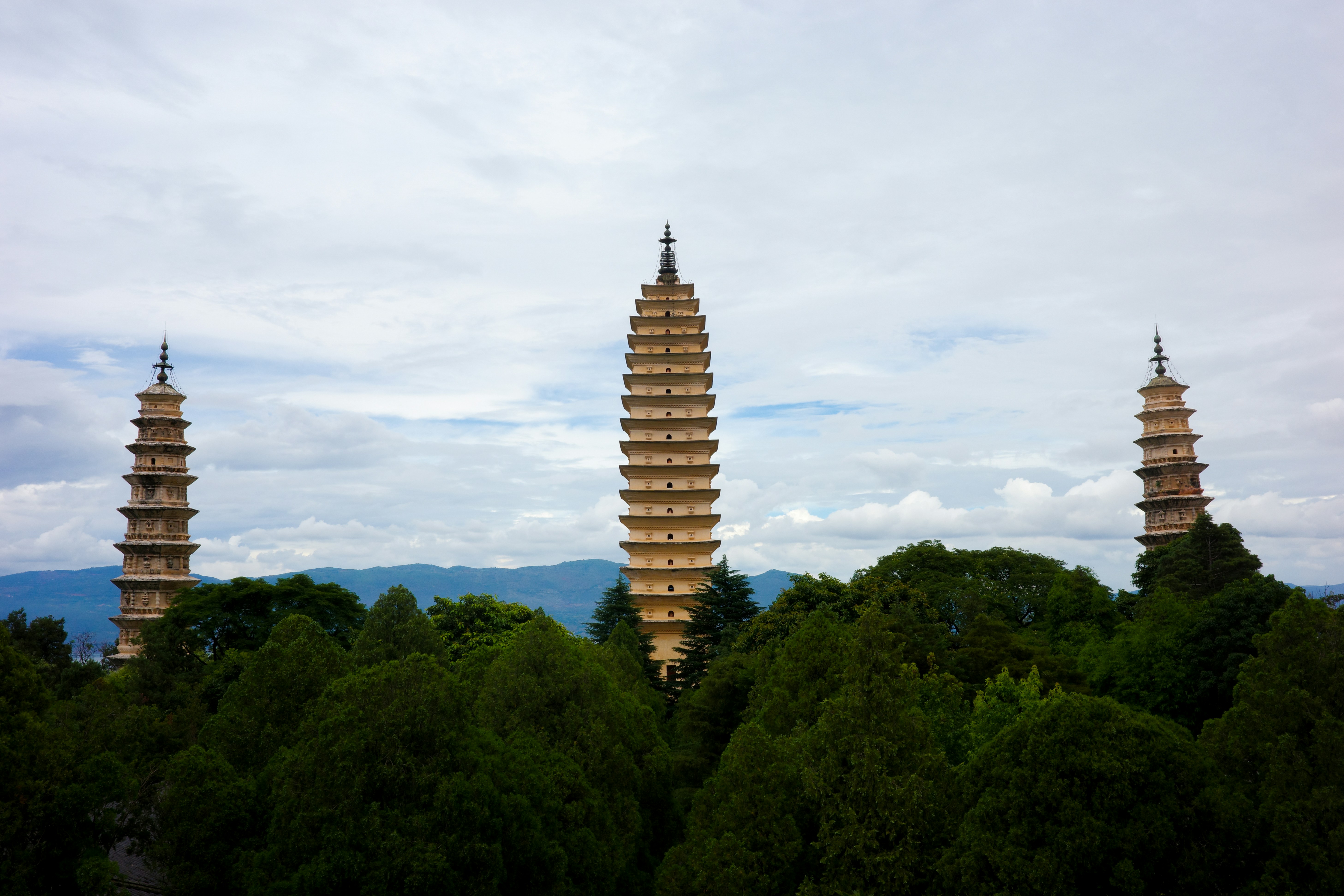 Three Ancient Towers Rise Above the Green Canopy