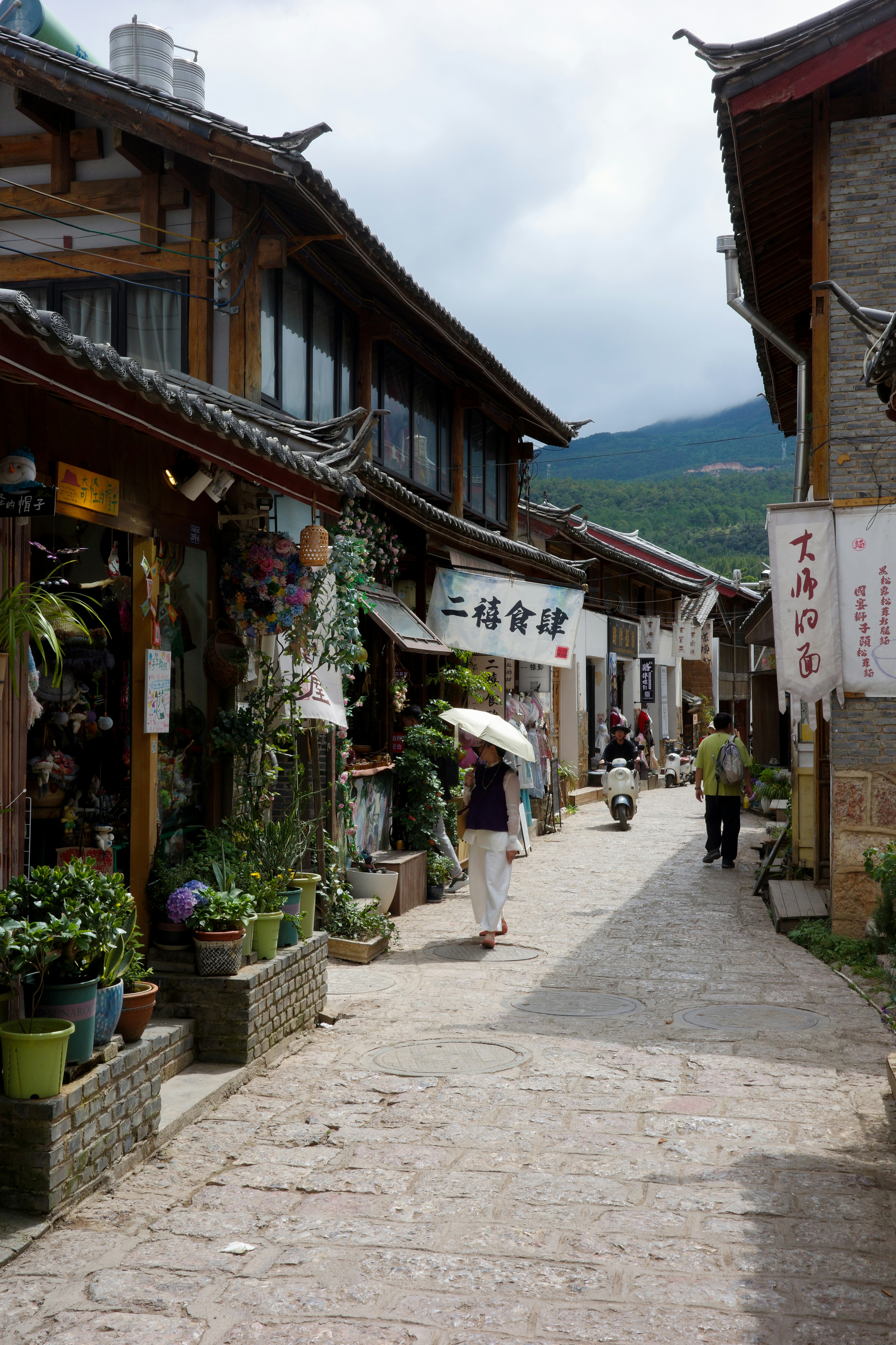 Stone-paved Street of Lanterns: A Quiet Moment Between Market Facades