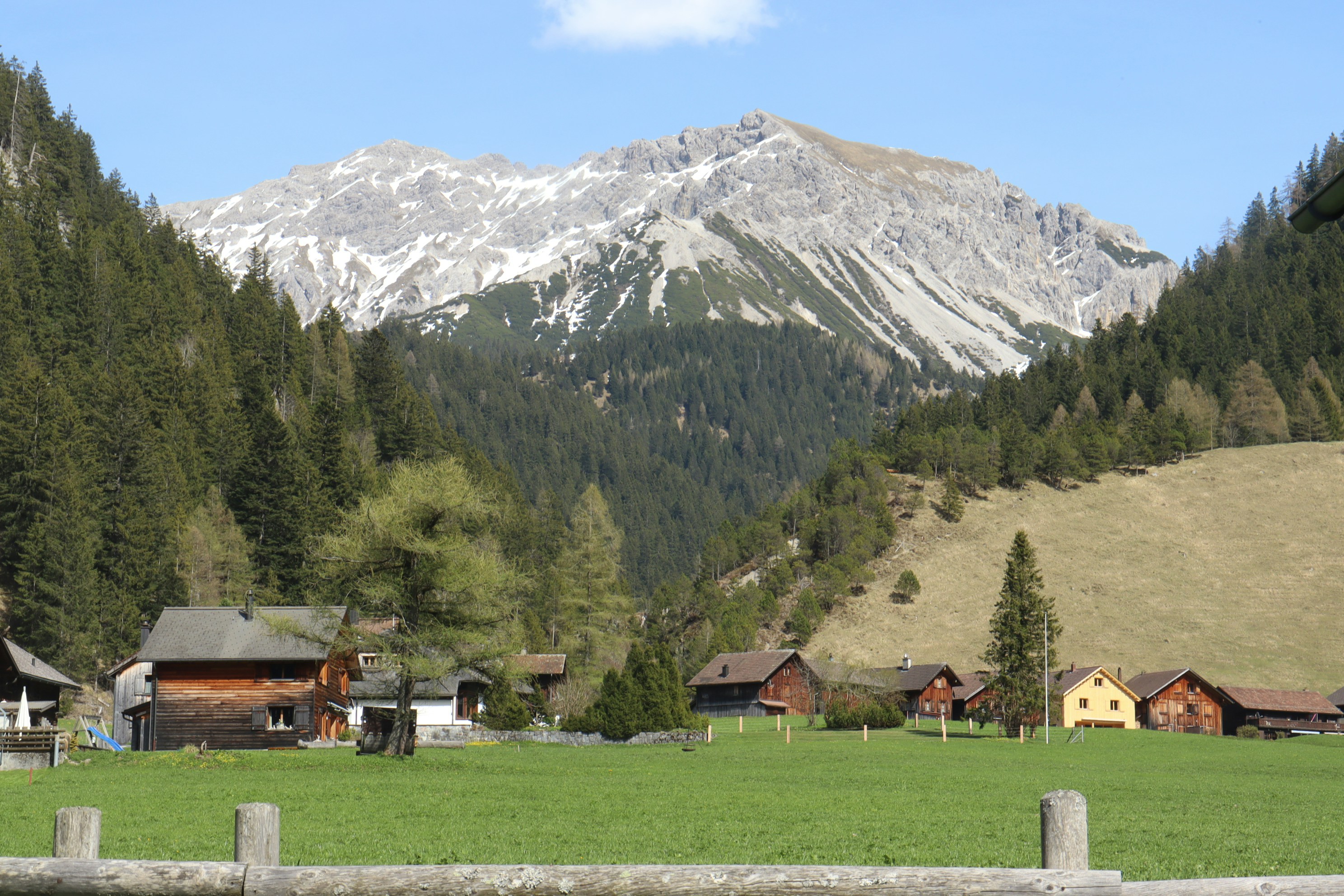 Alpine Village at the Foot of Rugged Peaks