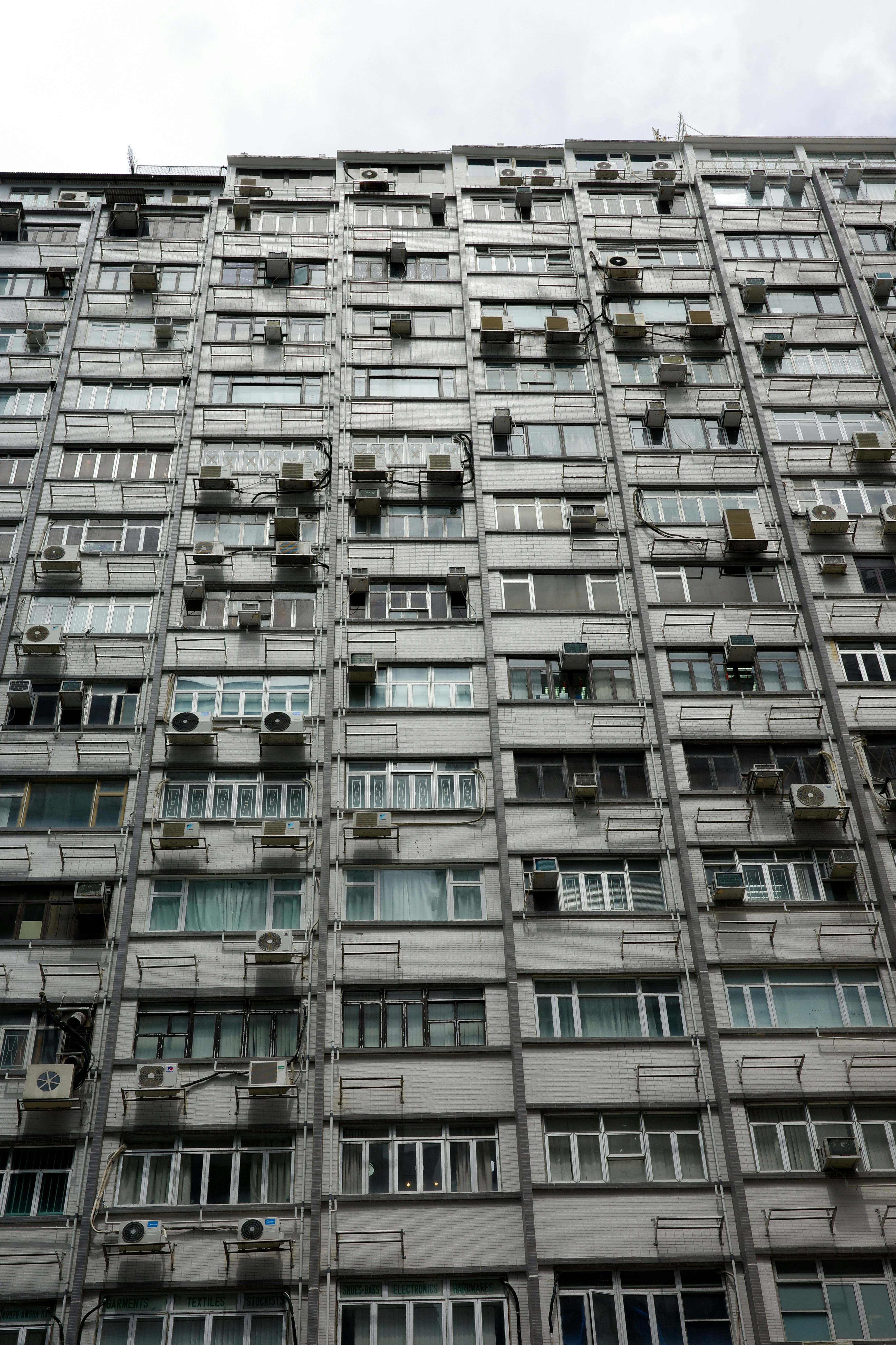 Concrete Clad: A Facade of Windows and Air Units