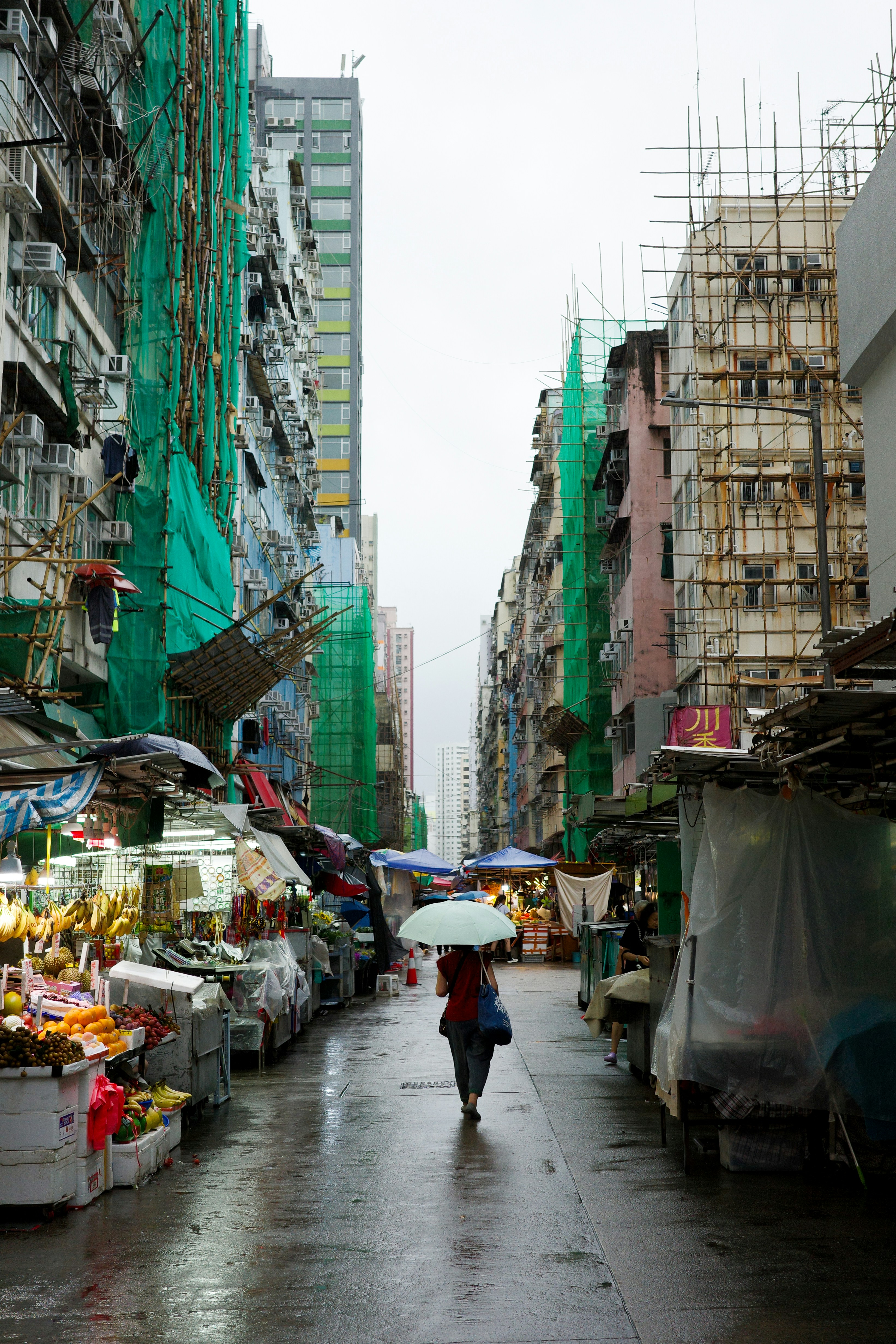 Quiet Downpour in a Market Street Under Construction